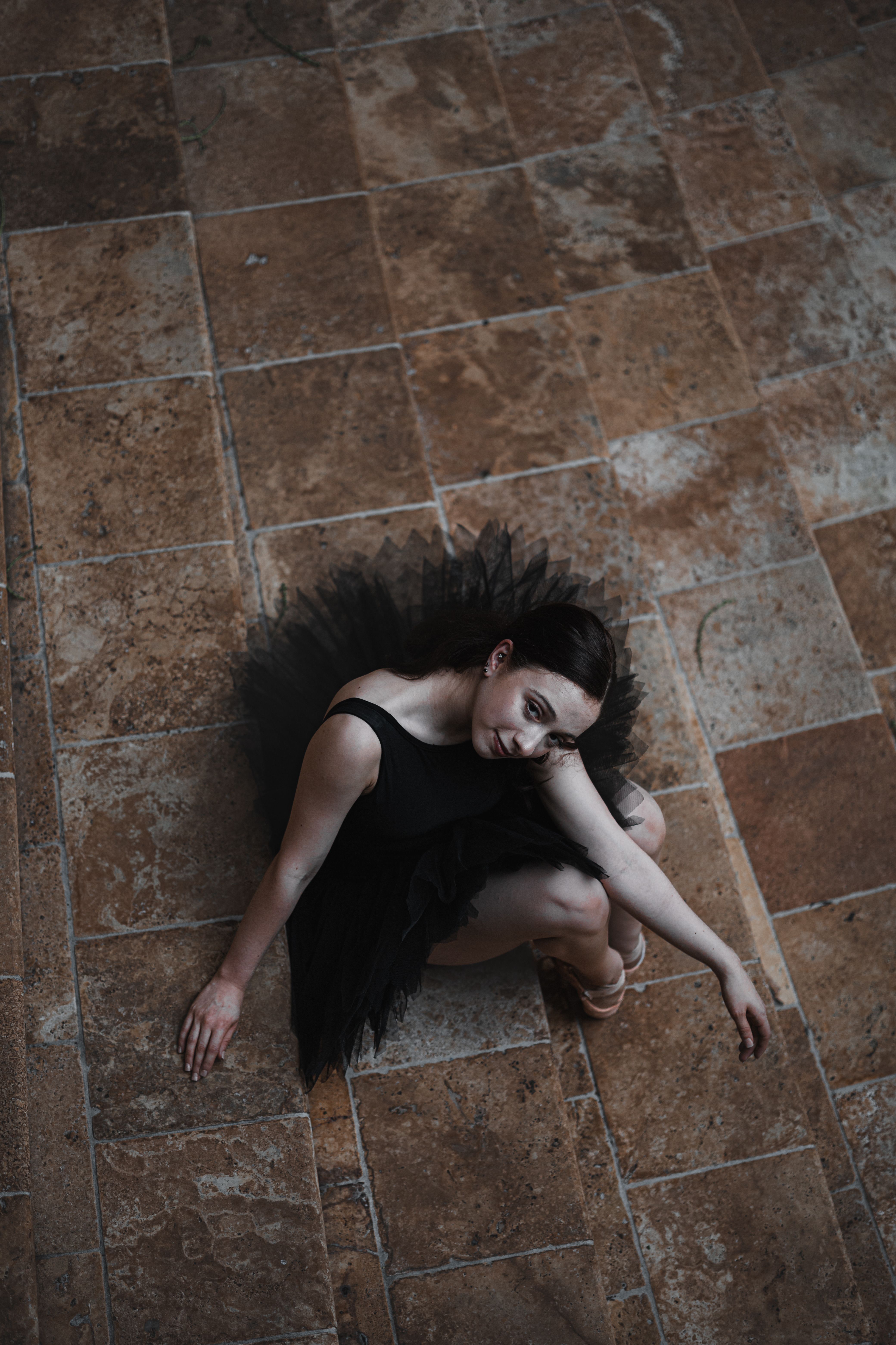 Woman in Black Ballet Dress Sitting on Stairs · Free Stock Photo