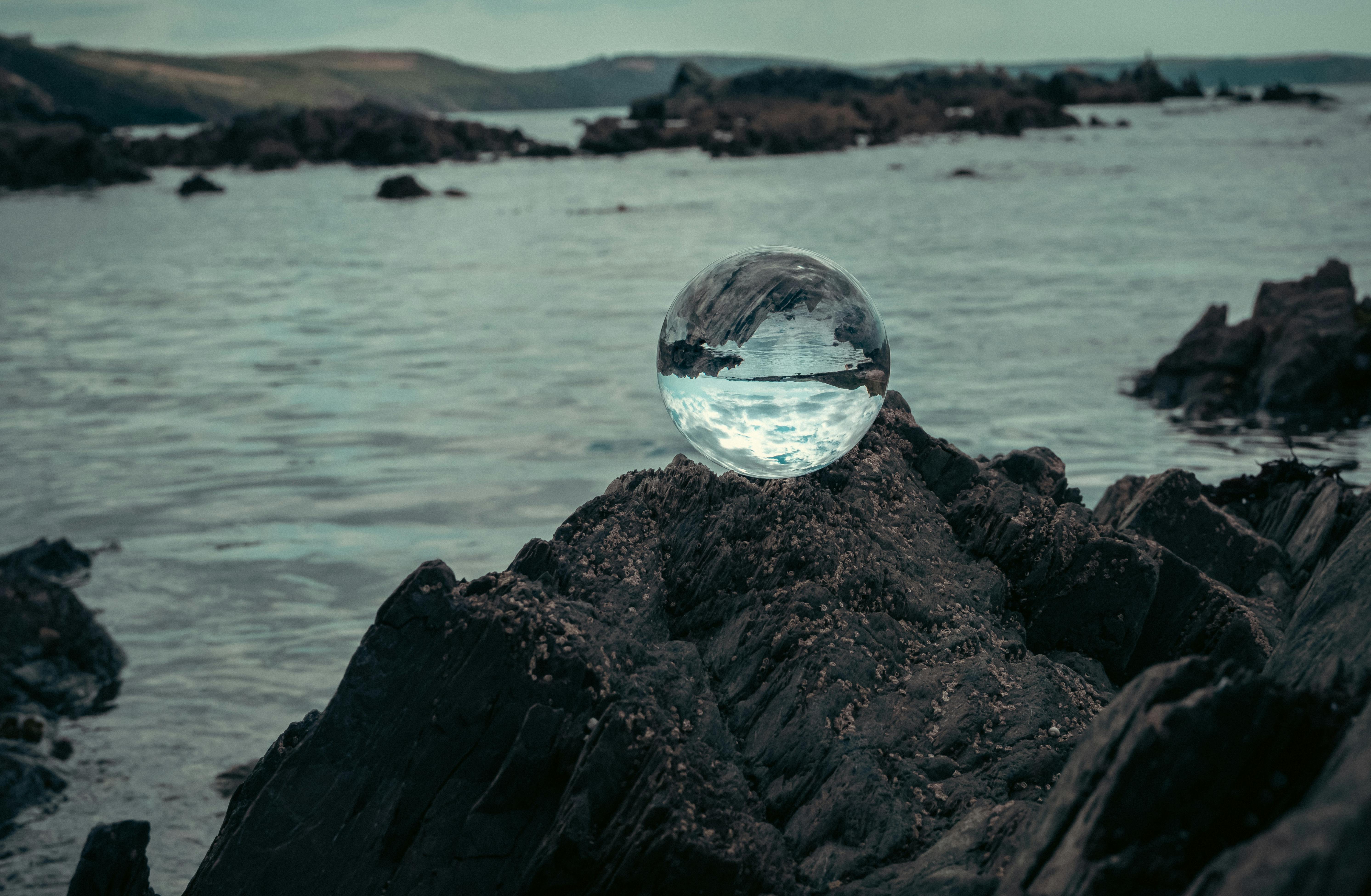 Reflection of Rocky Beach in Sphere · Free Stock Photo