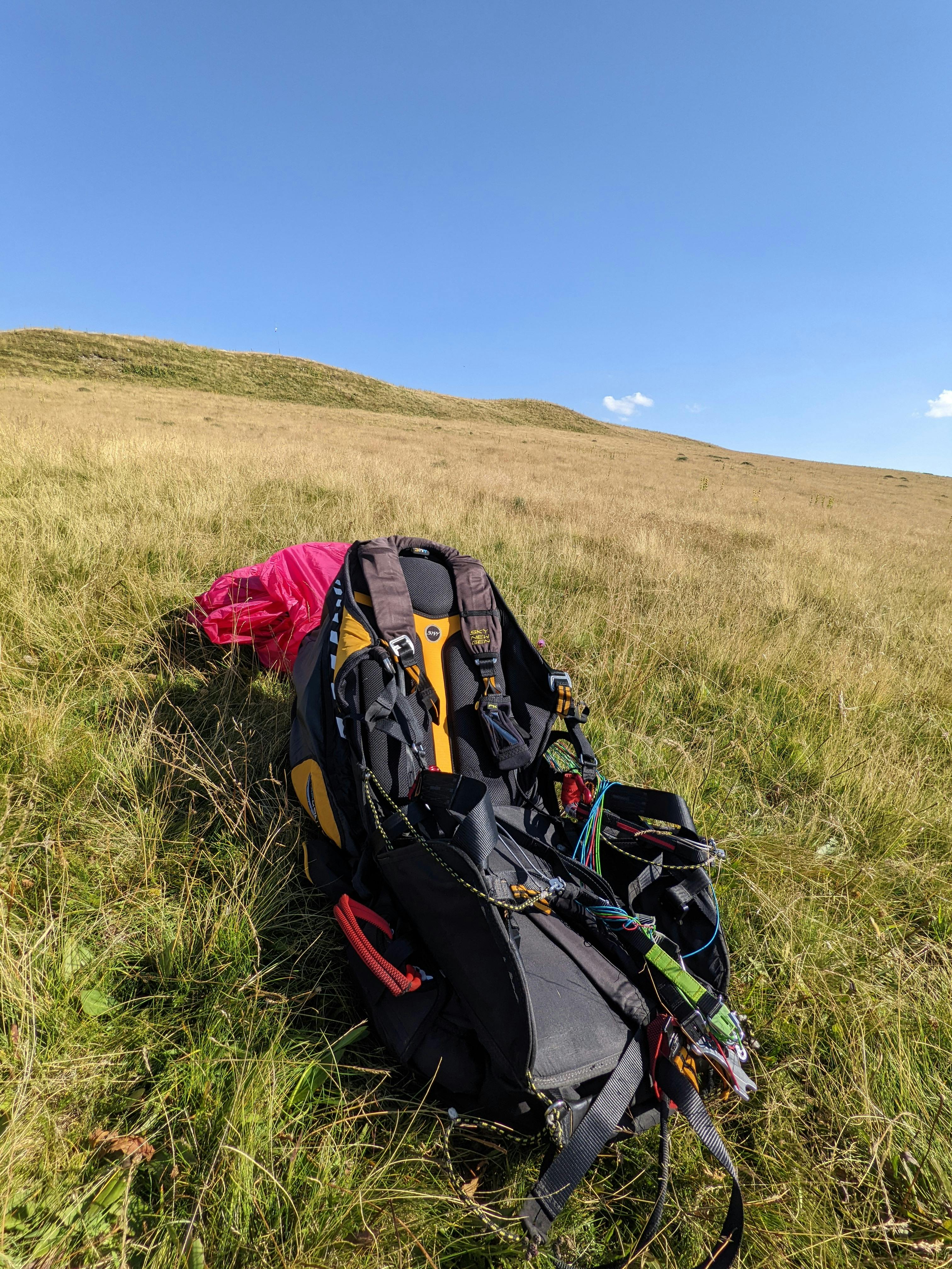 Paraglider Seat on Grass Field · Free Stock Photo