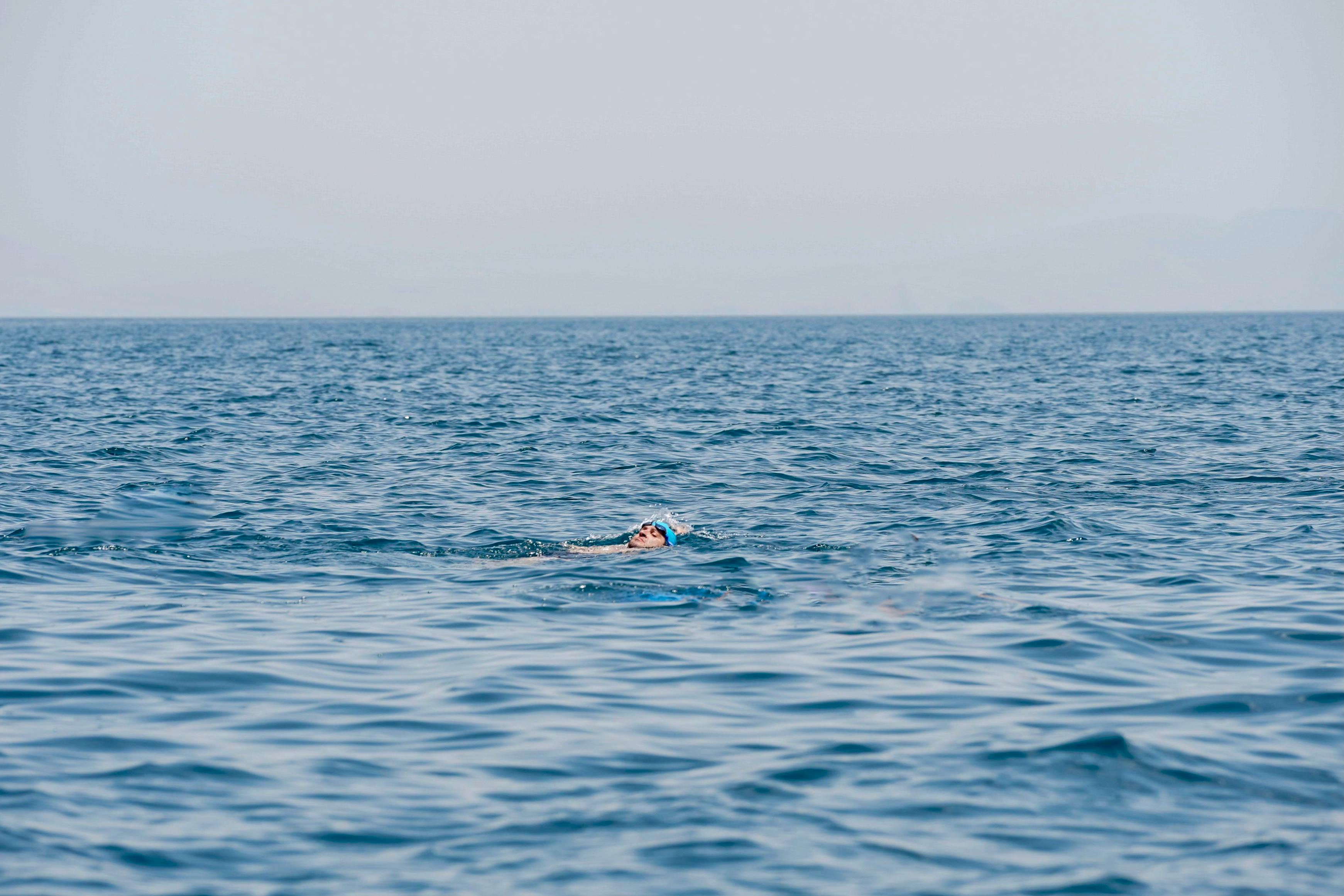 Person Swimming on Ocean · Free Stock Photo