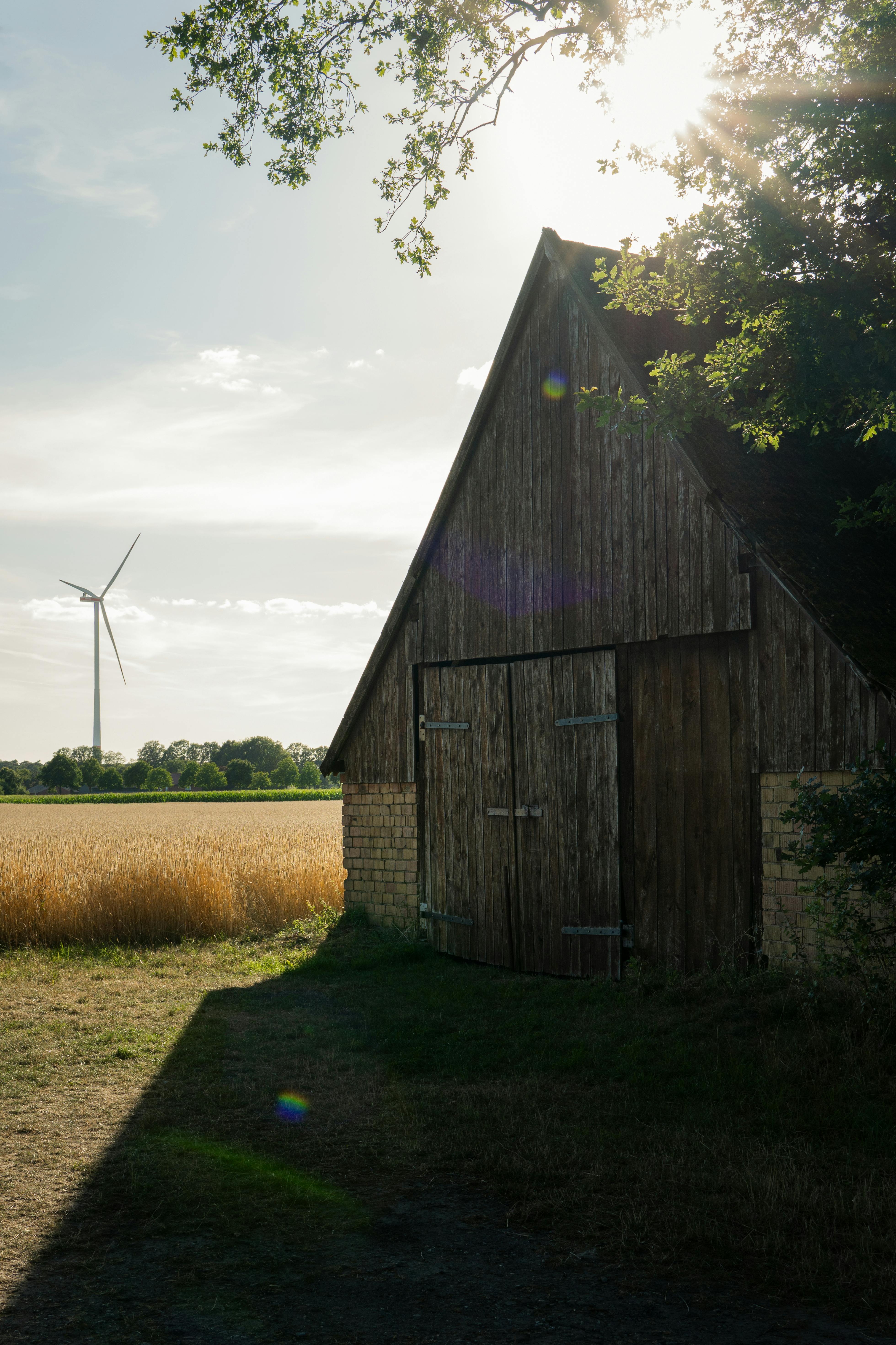 Wooden Barn Beside Brown Grass Field · Free Stock Photo