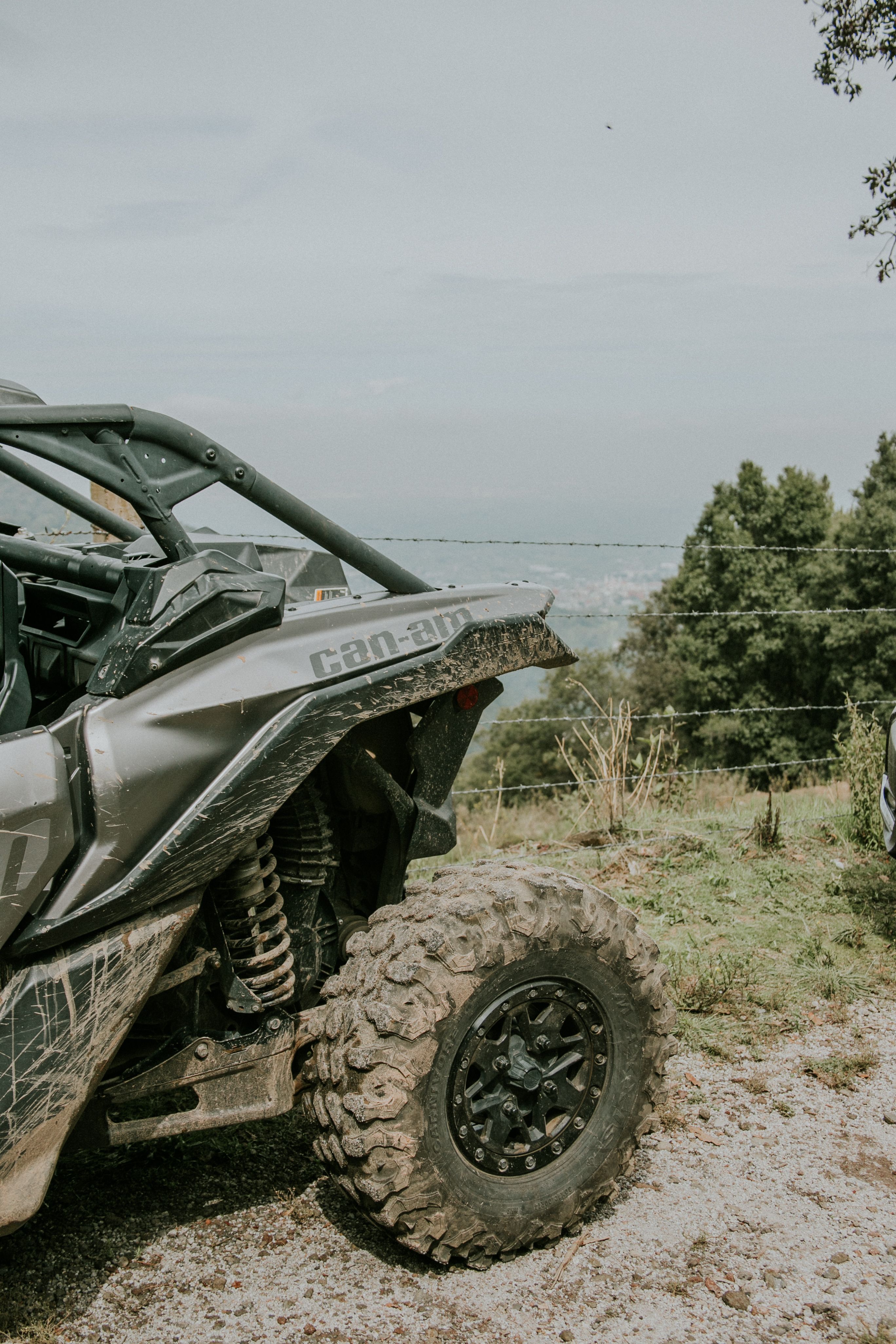 An All Terrain Vehicle Near Barbed Wire · Free Stock Photo