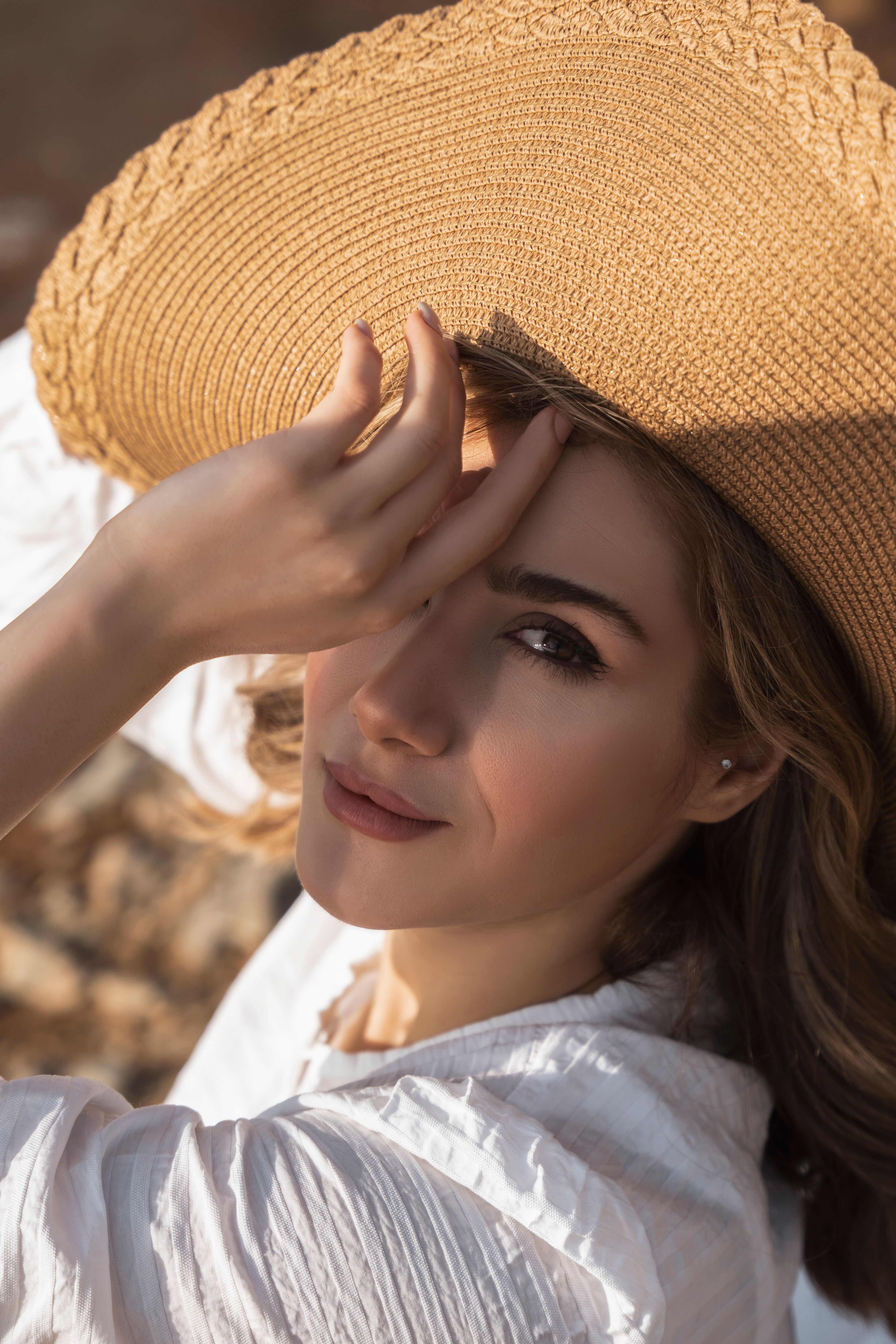 White Hat in Woman's Face · Free Stock Photo