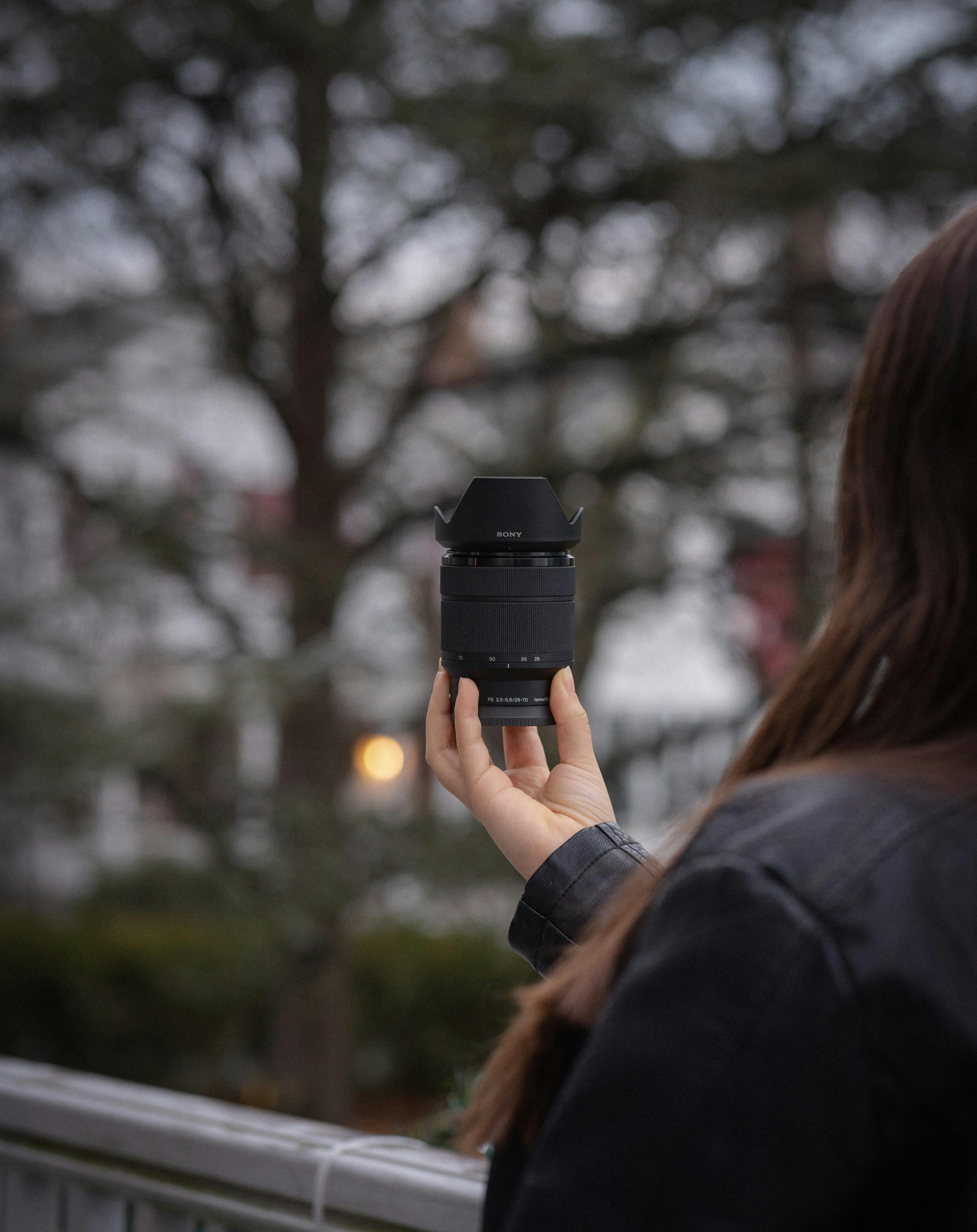 Person Holding a Dslr Camera · Free Stock Photo