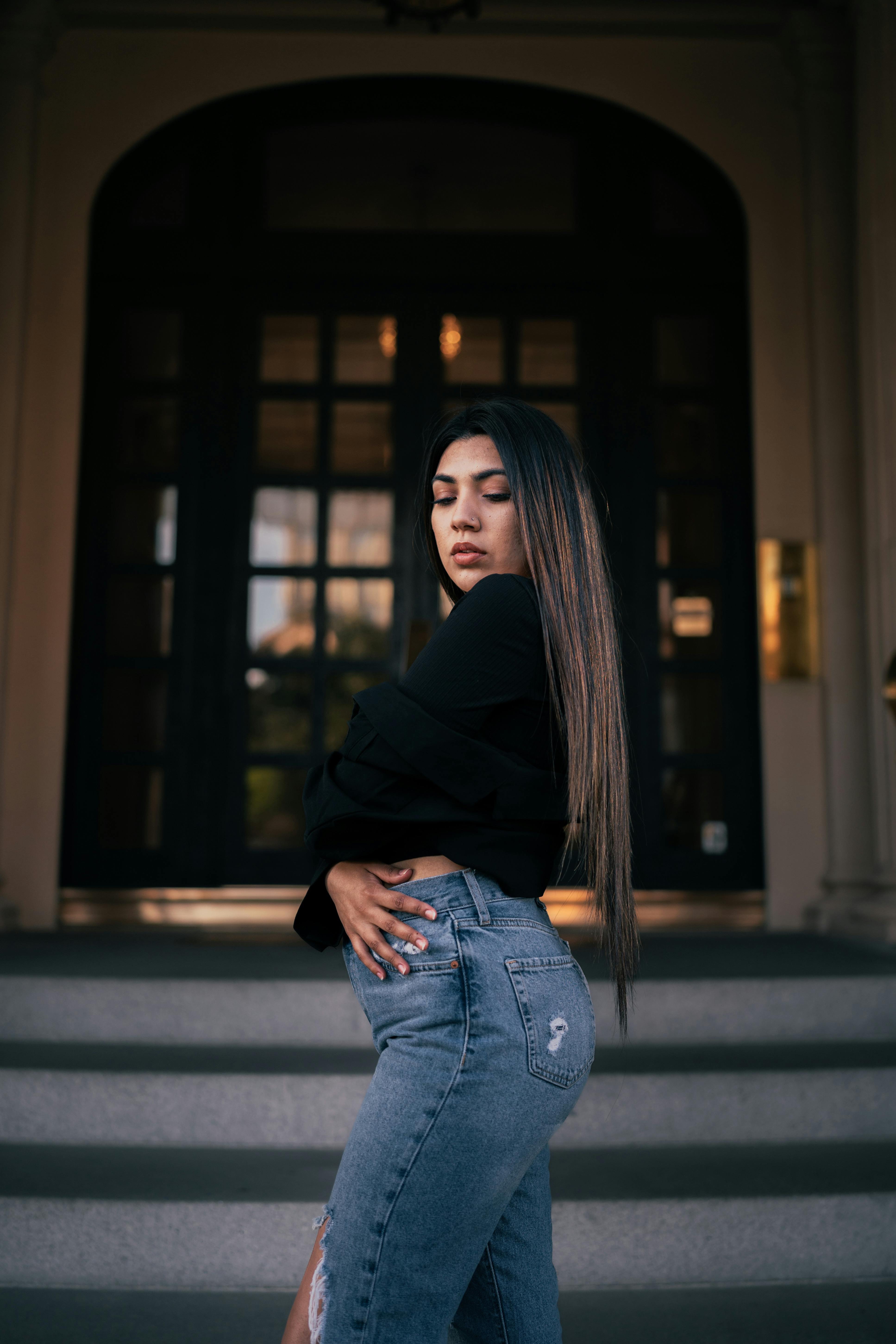 Man Standing in Provocative Pose Wearing Brown Jacket · Free Stock Photo