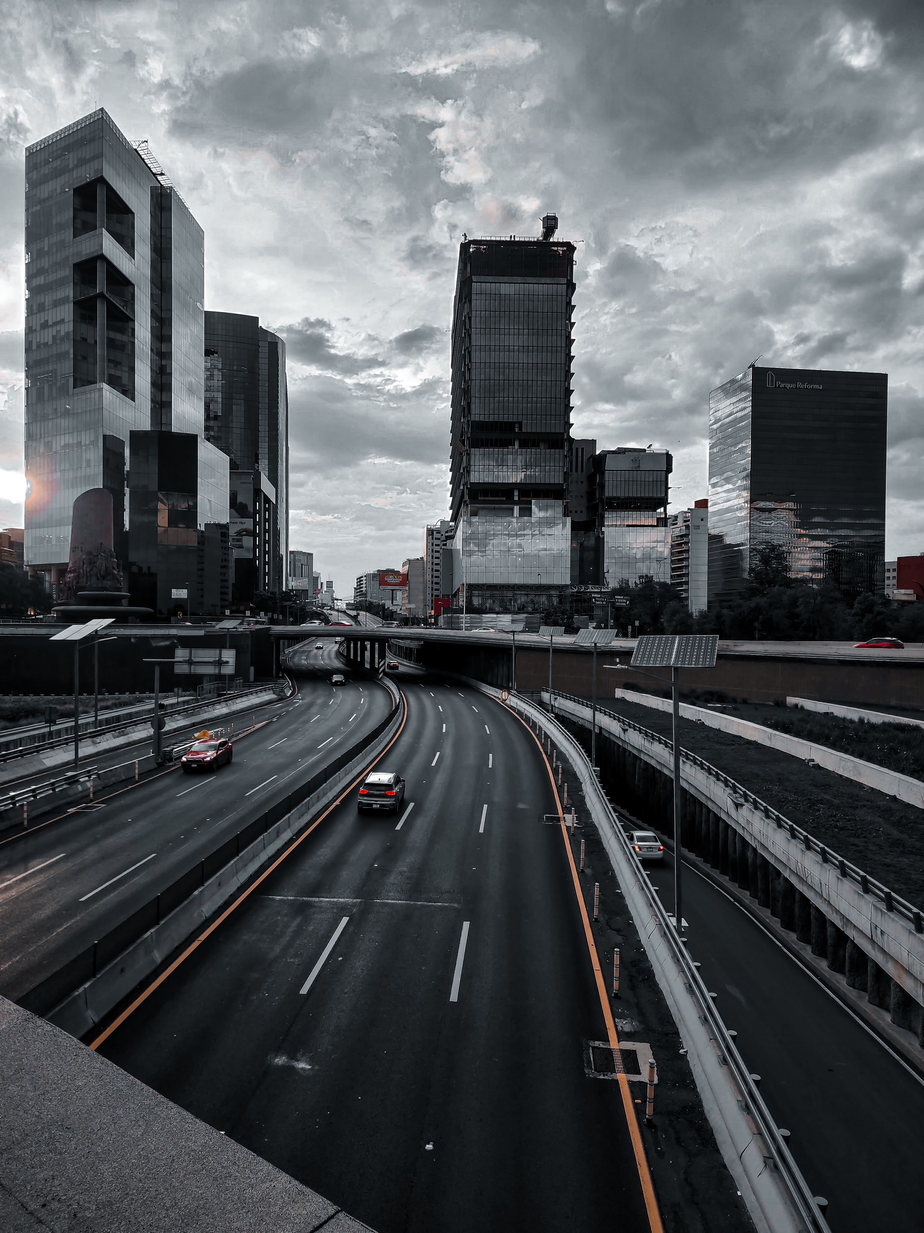 Cars Parked on Street Near High Rise Building · Free Stock Photo