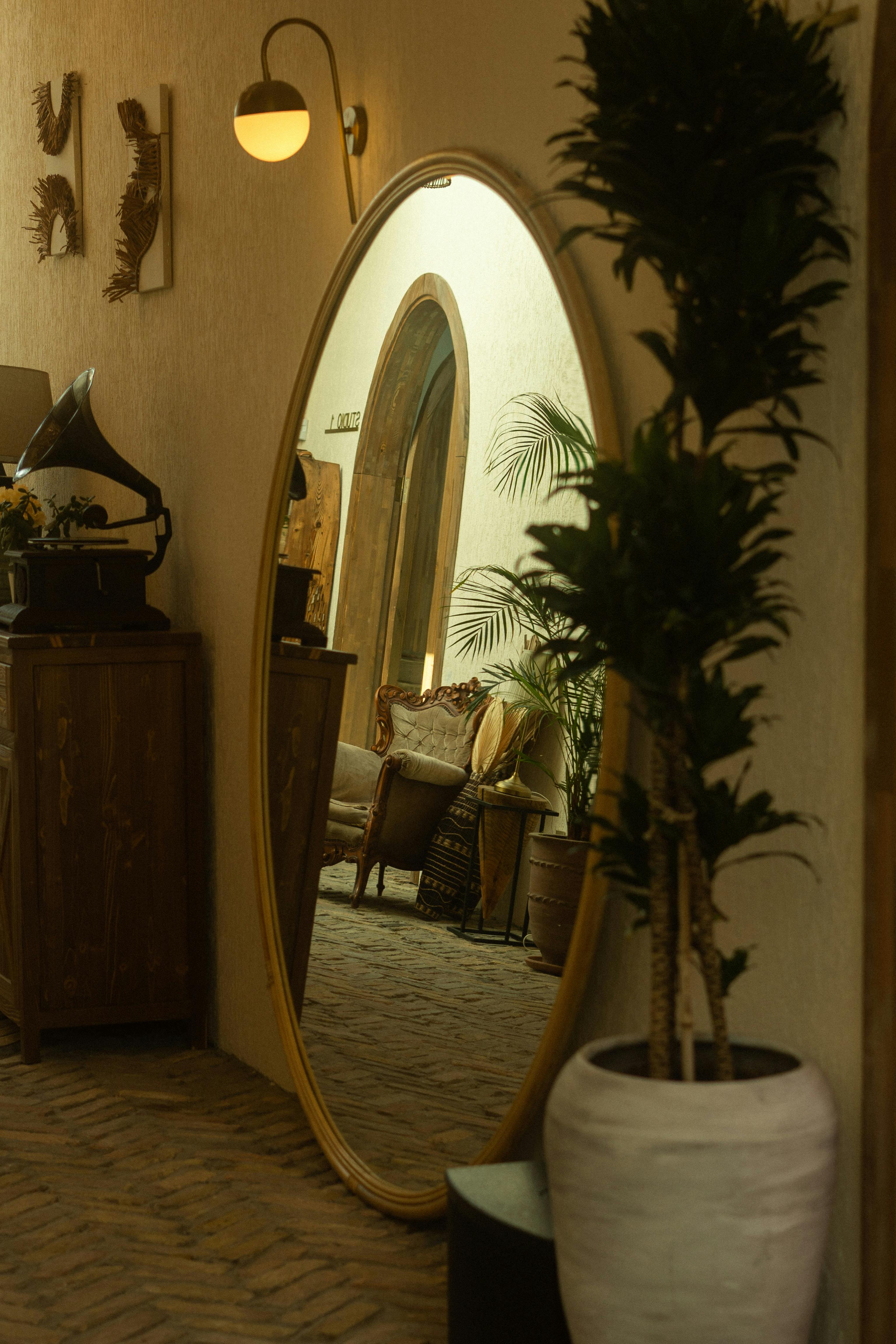 Women Reflection on a Wall Mirror · Free Stock Photo