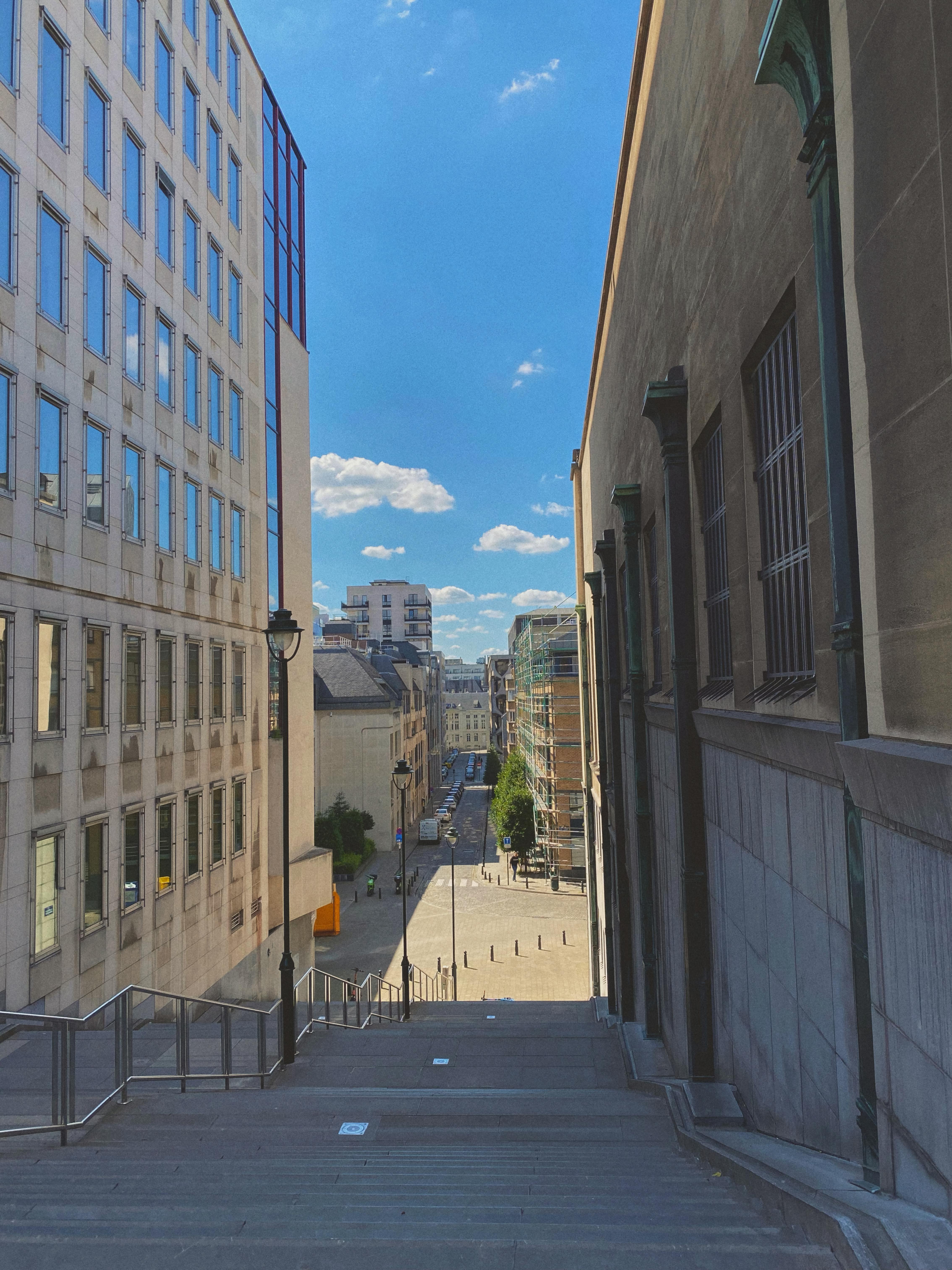 Narrow Street between Concrete Buildings · Free Stock Photo