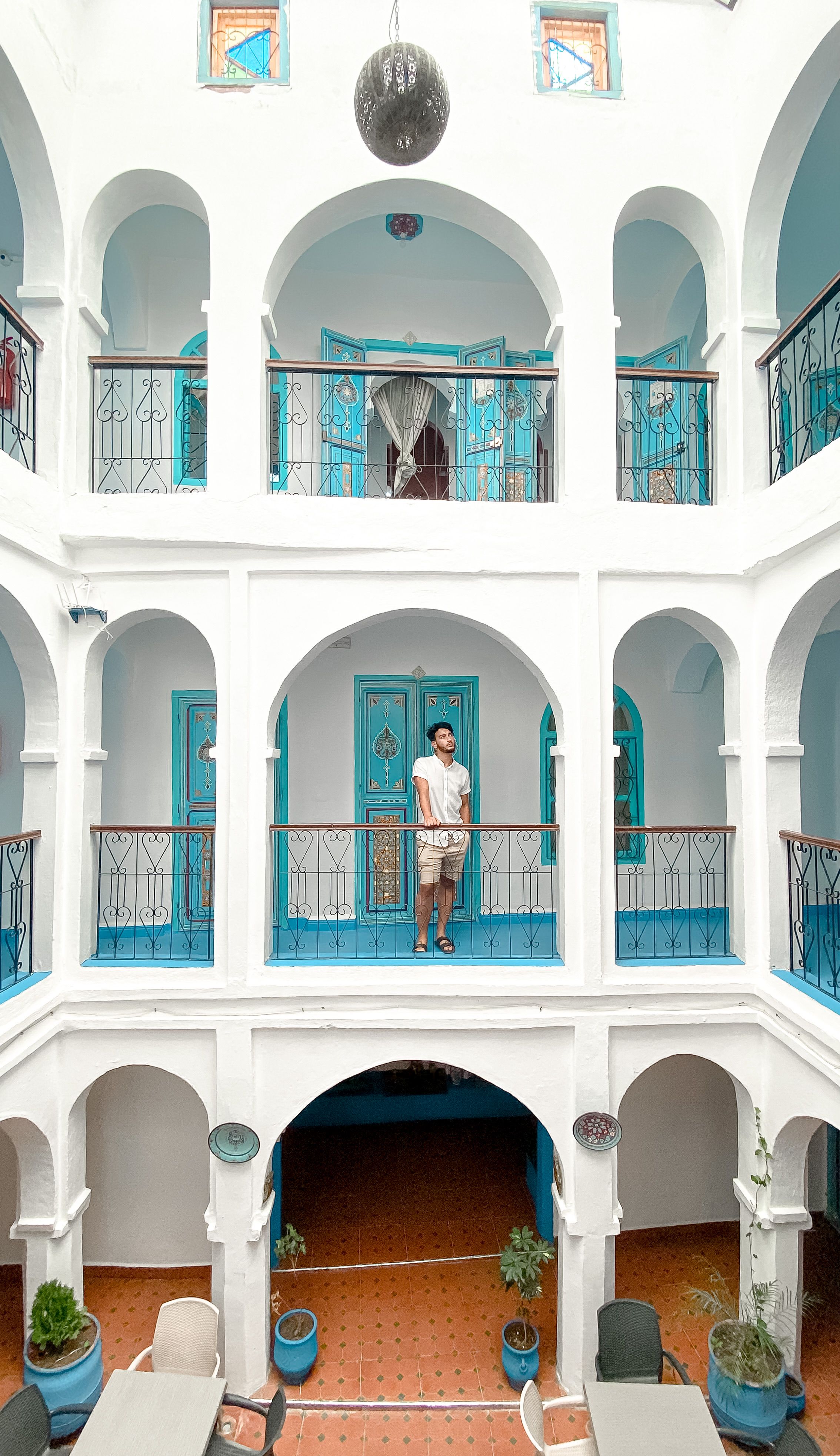 White Building with Arcades and Turquoise Doors · Free Stock Photo
