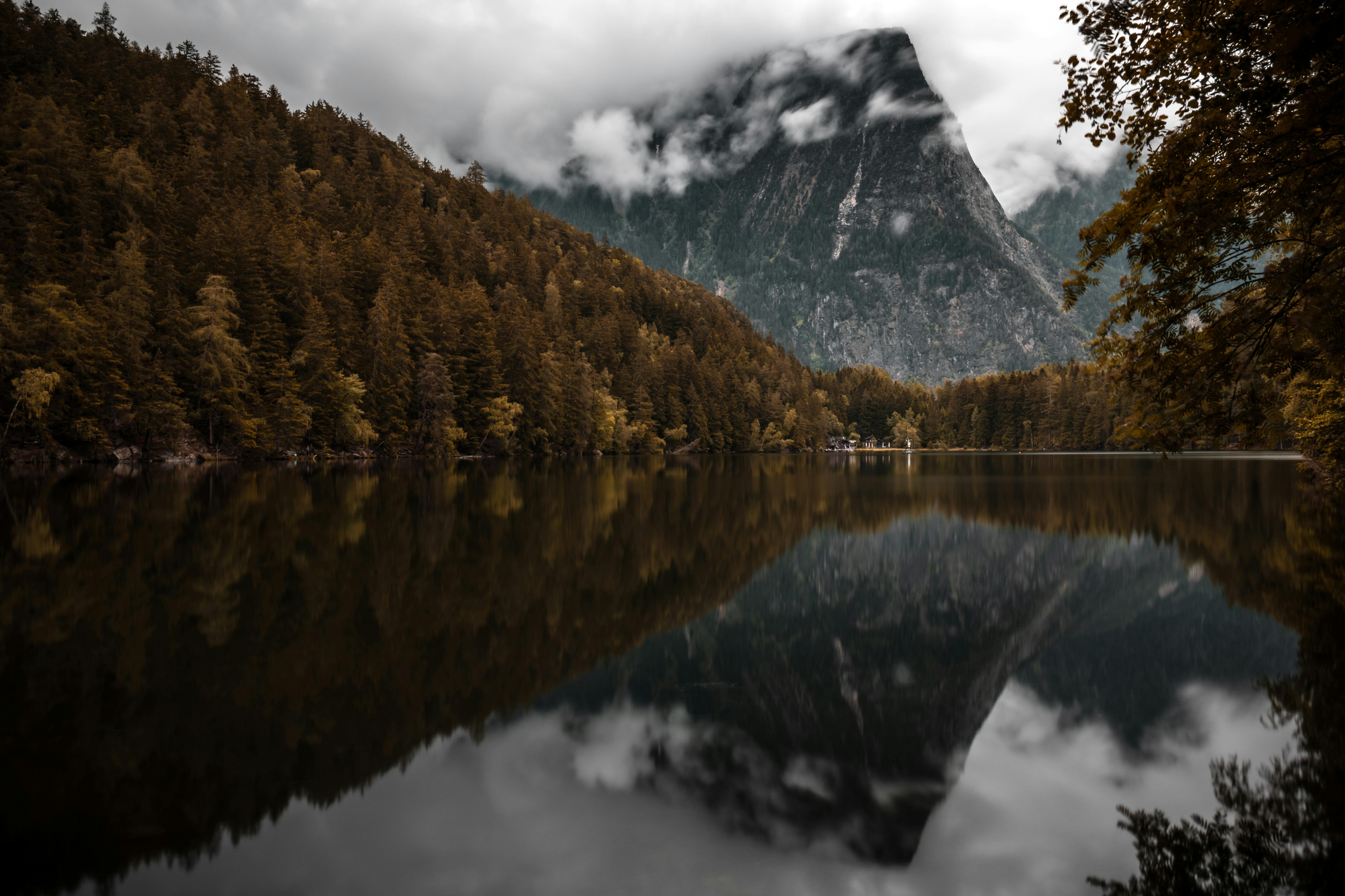 Calm Lake near Trees and Mountain · Free Stock Photo