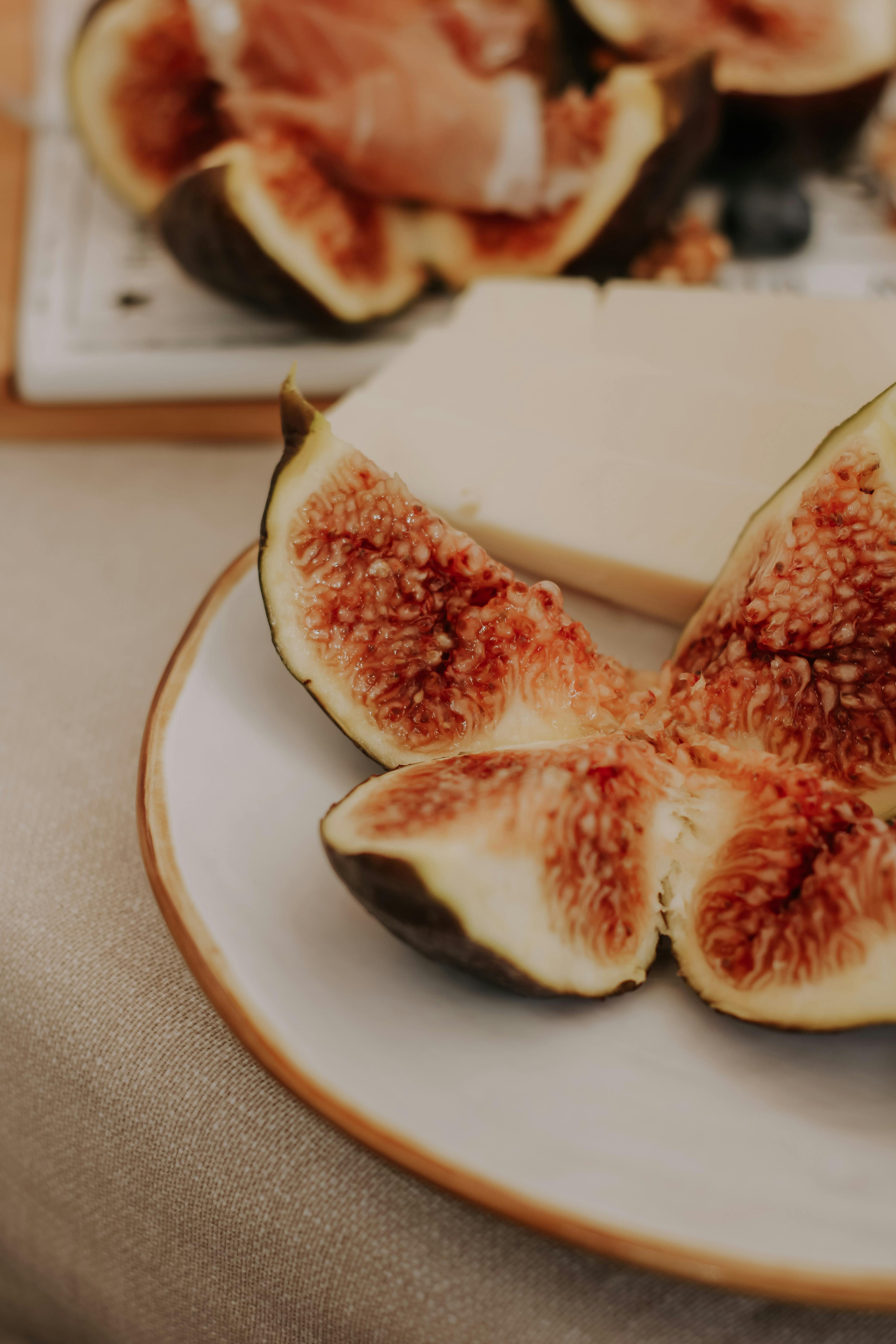 Whole Fig Fruit and a Slice with Black Background · Free Stock Photo