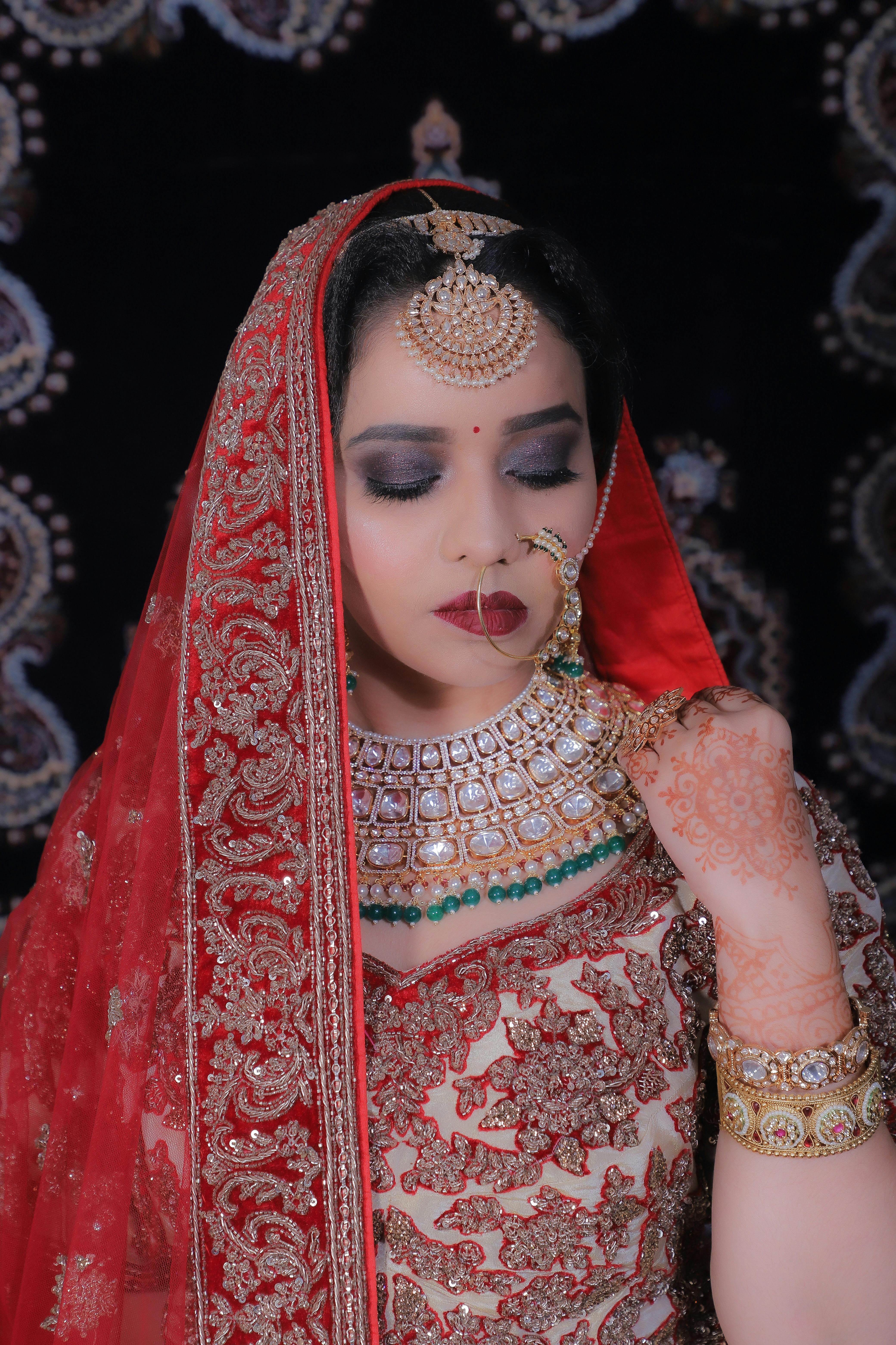 A Woman in Red and Silver Sari · Free Stock Photo