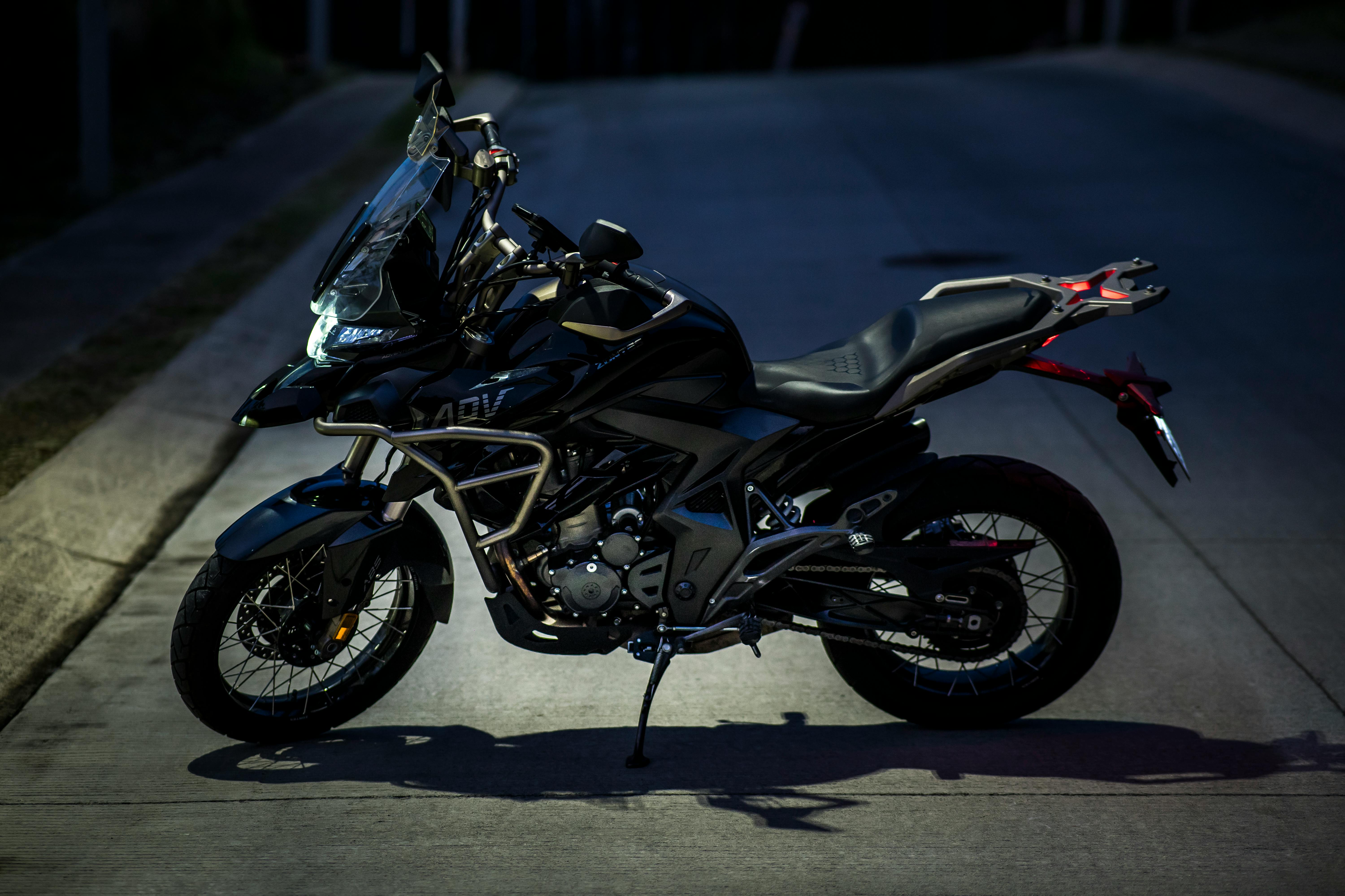 Black and Silver Cruiser Motorcycle on Gray Sand · Free Stock Photo