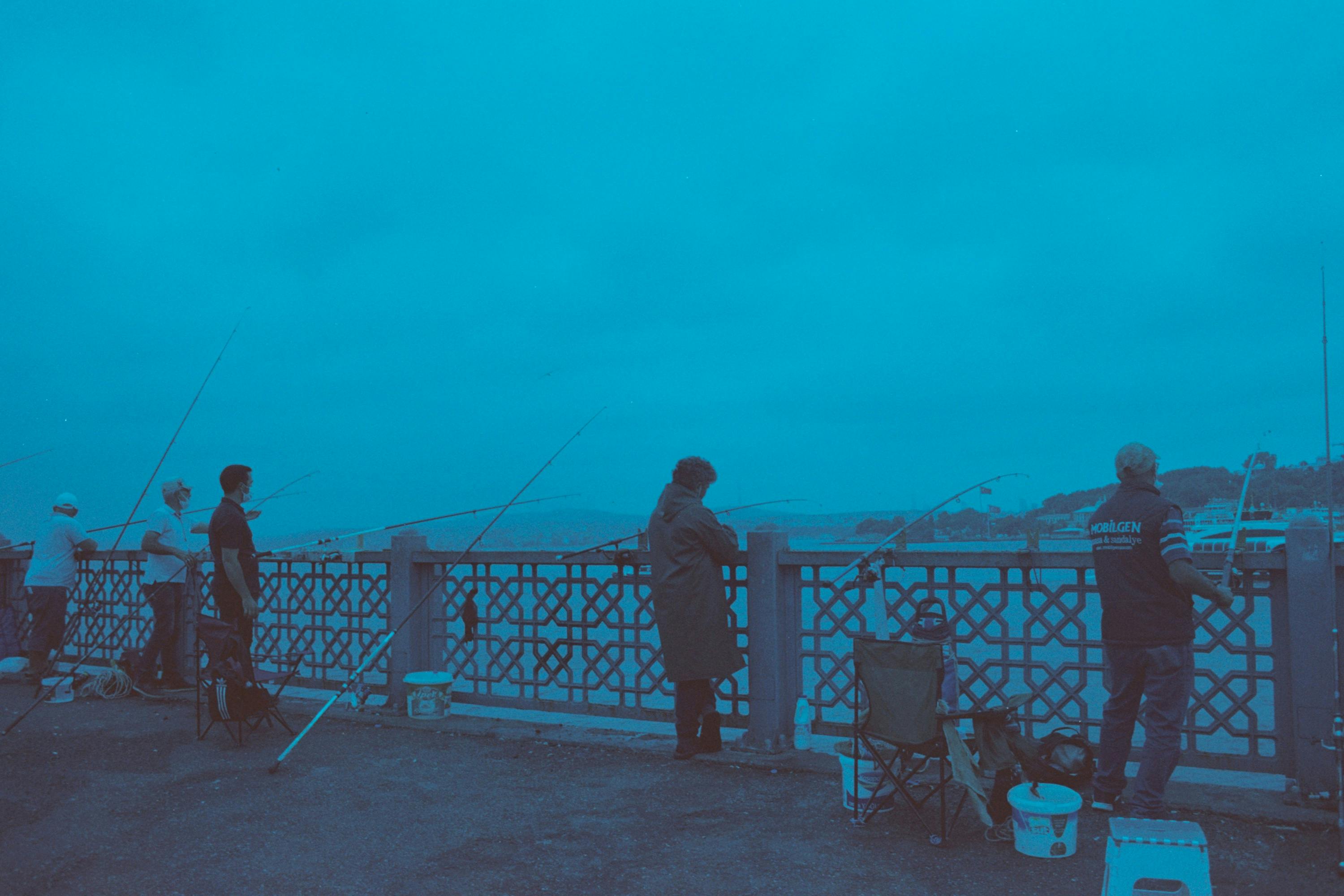 Men Fishing at the Waterfront · Free Stock Photo