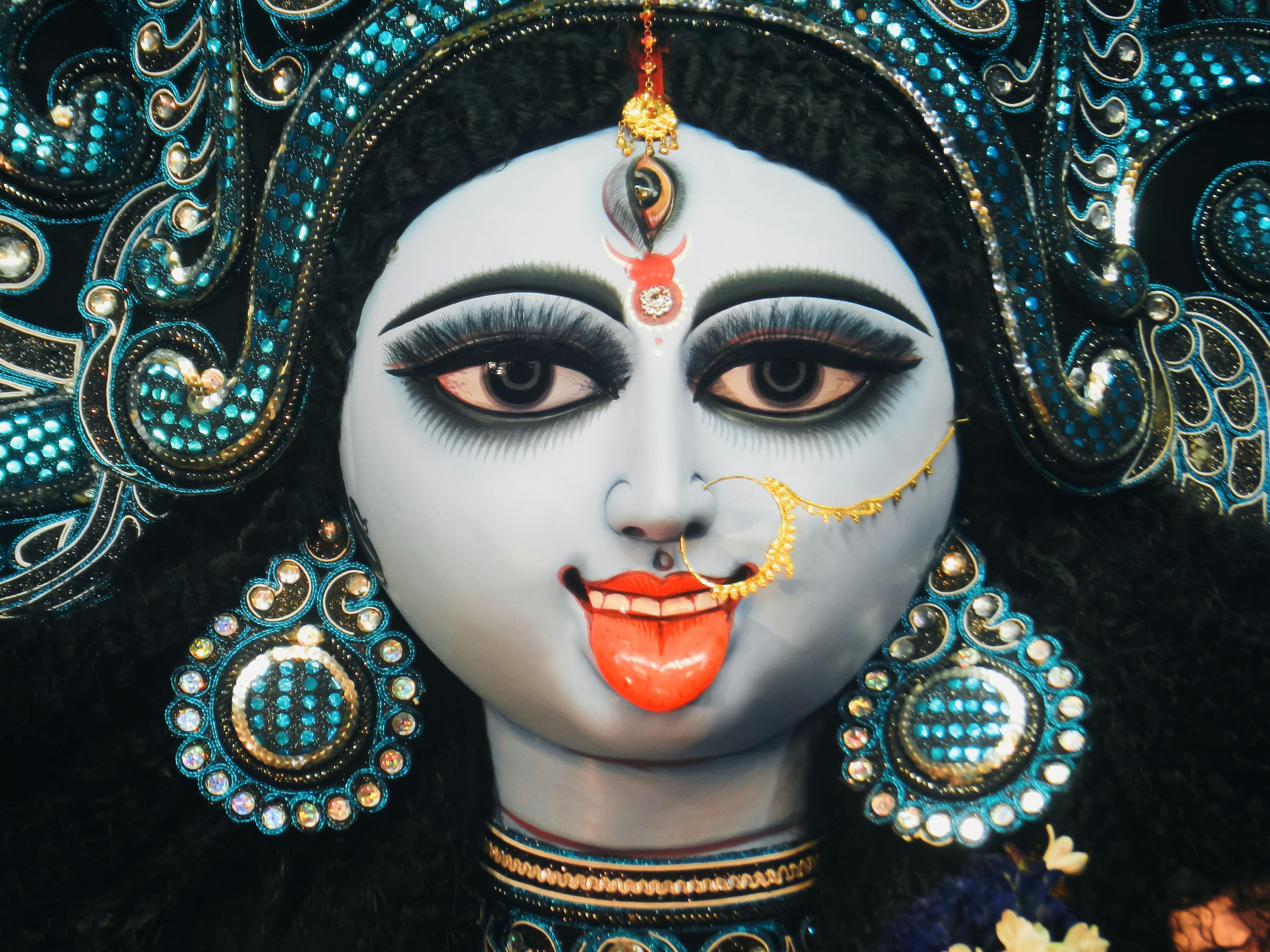 Statue of Hindu God Kali Puja on Black Background · Free Stock Photo