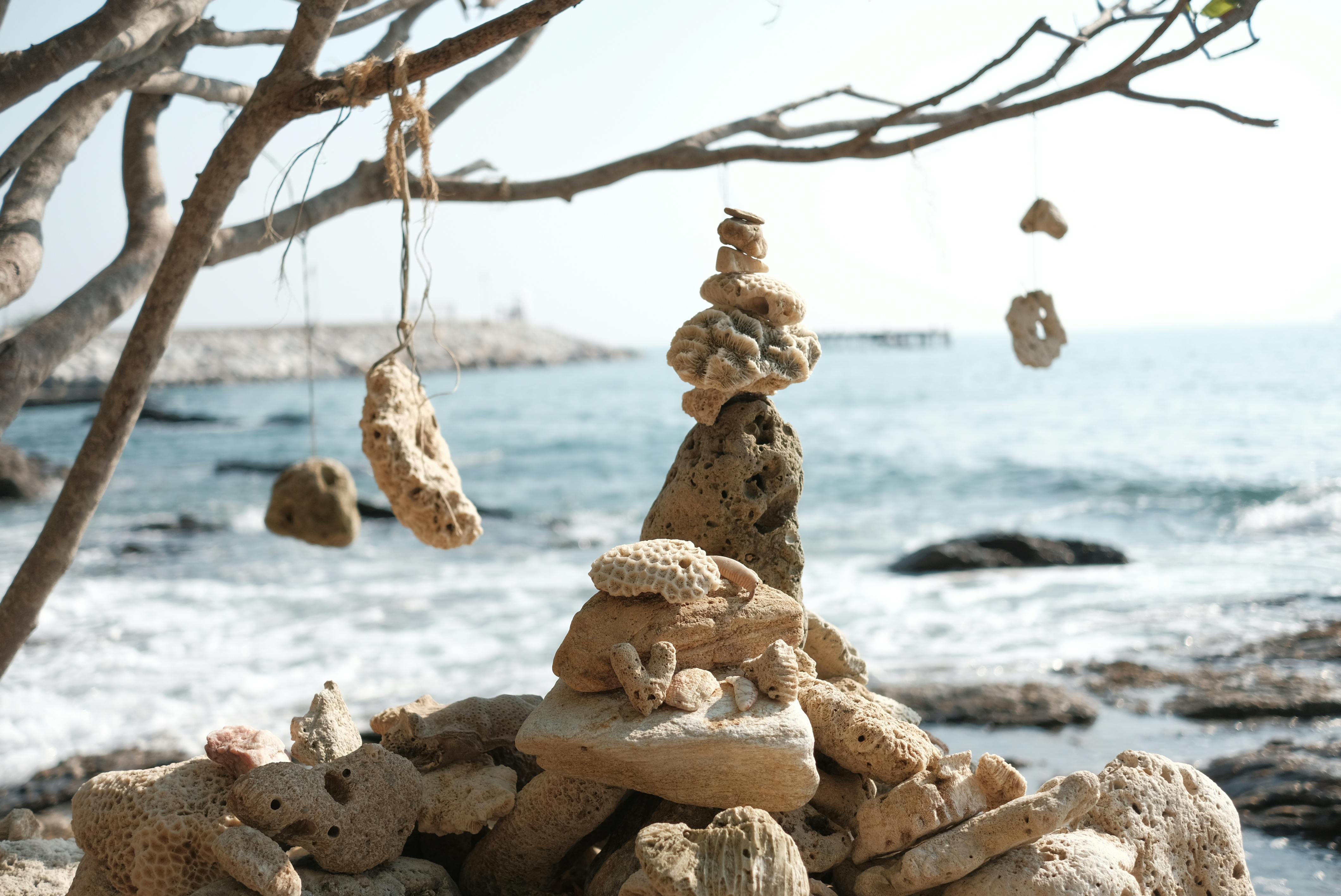 A Grey Stone Stocking Near Body of Water · Free Stock Photo