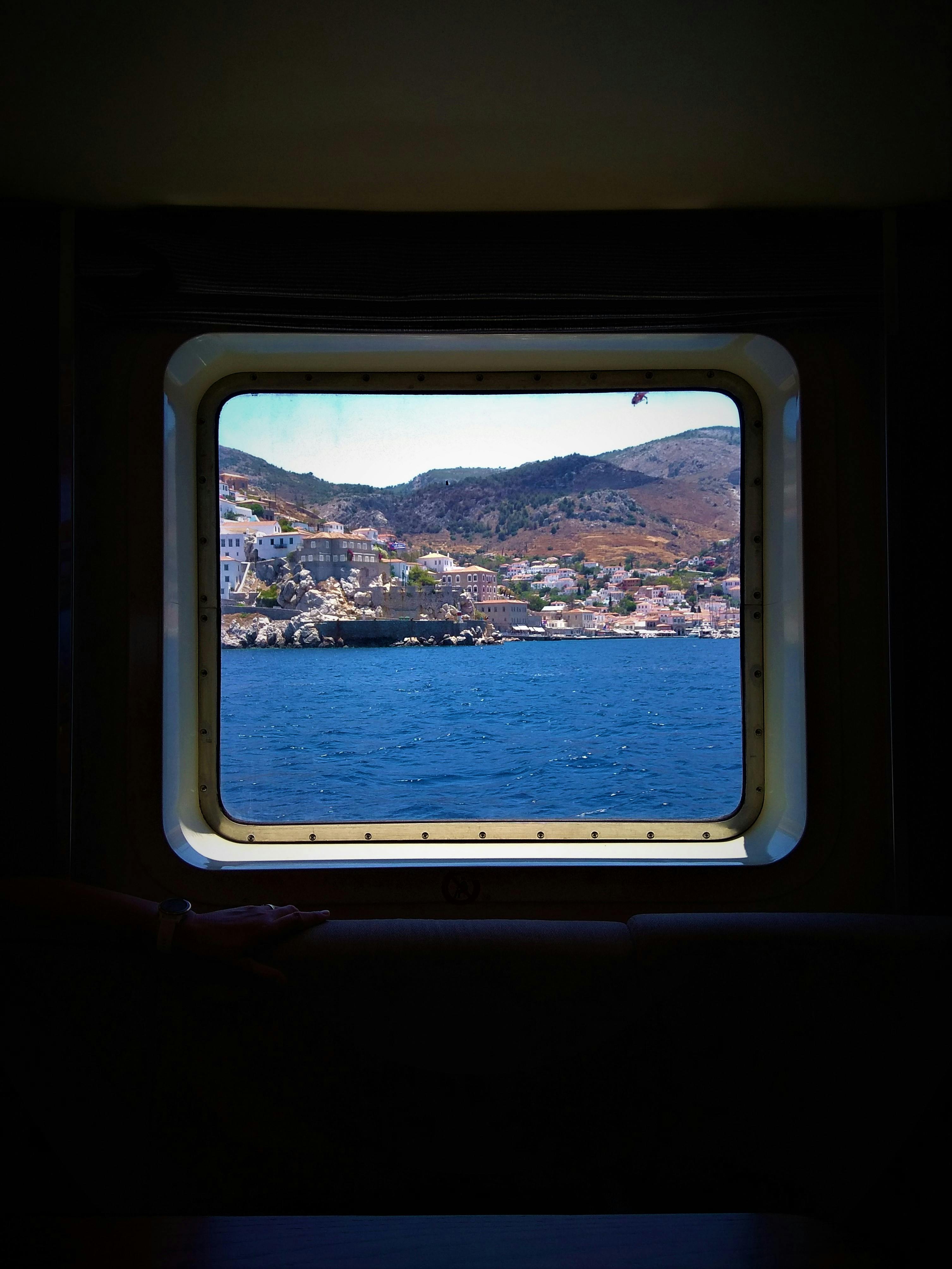 A View of the Ocean and a Coastal City from inside a Ship · Free Stock ...