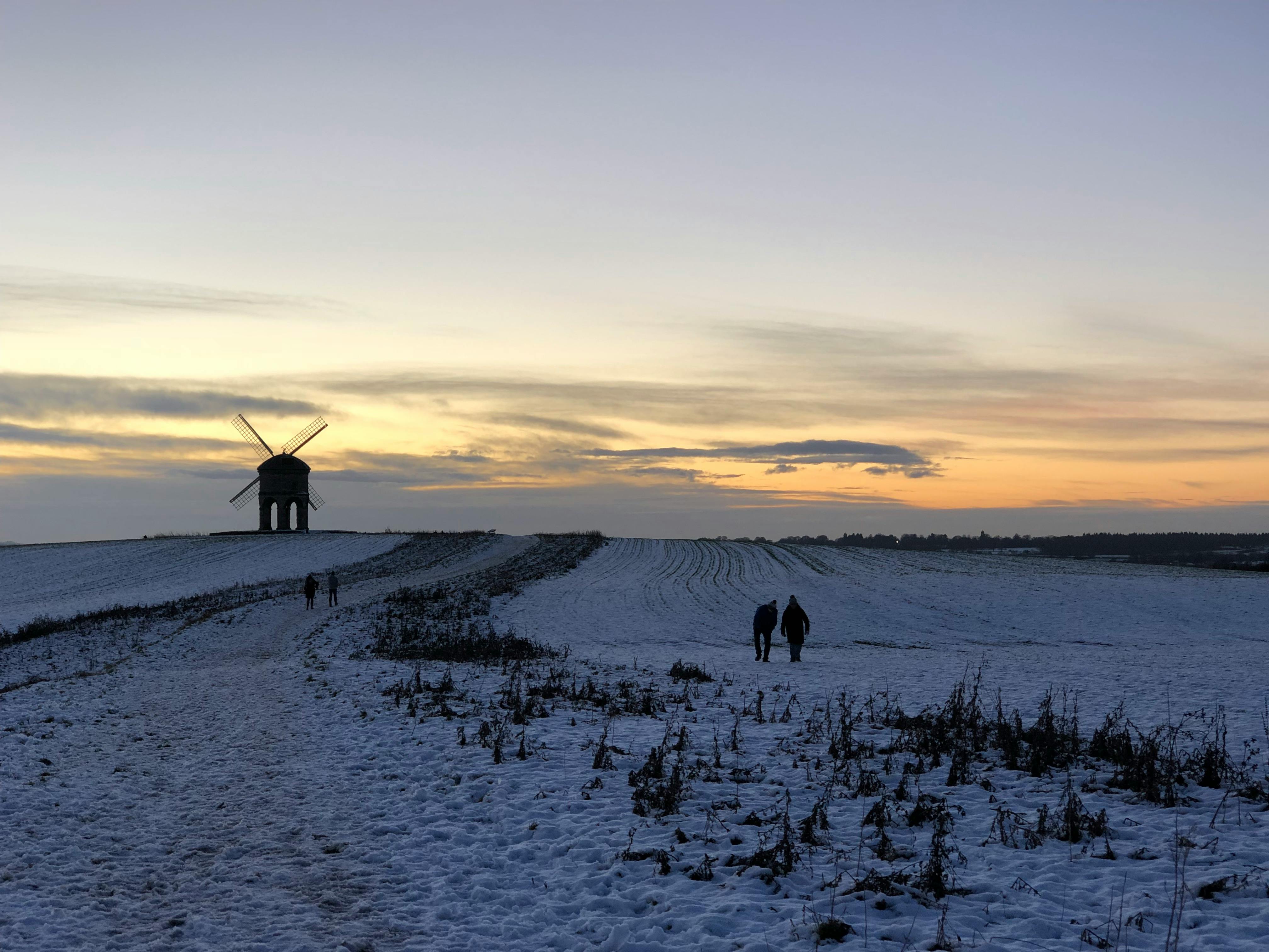 Sunset over a Snowy Coast · Free Stock Photo