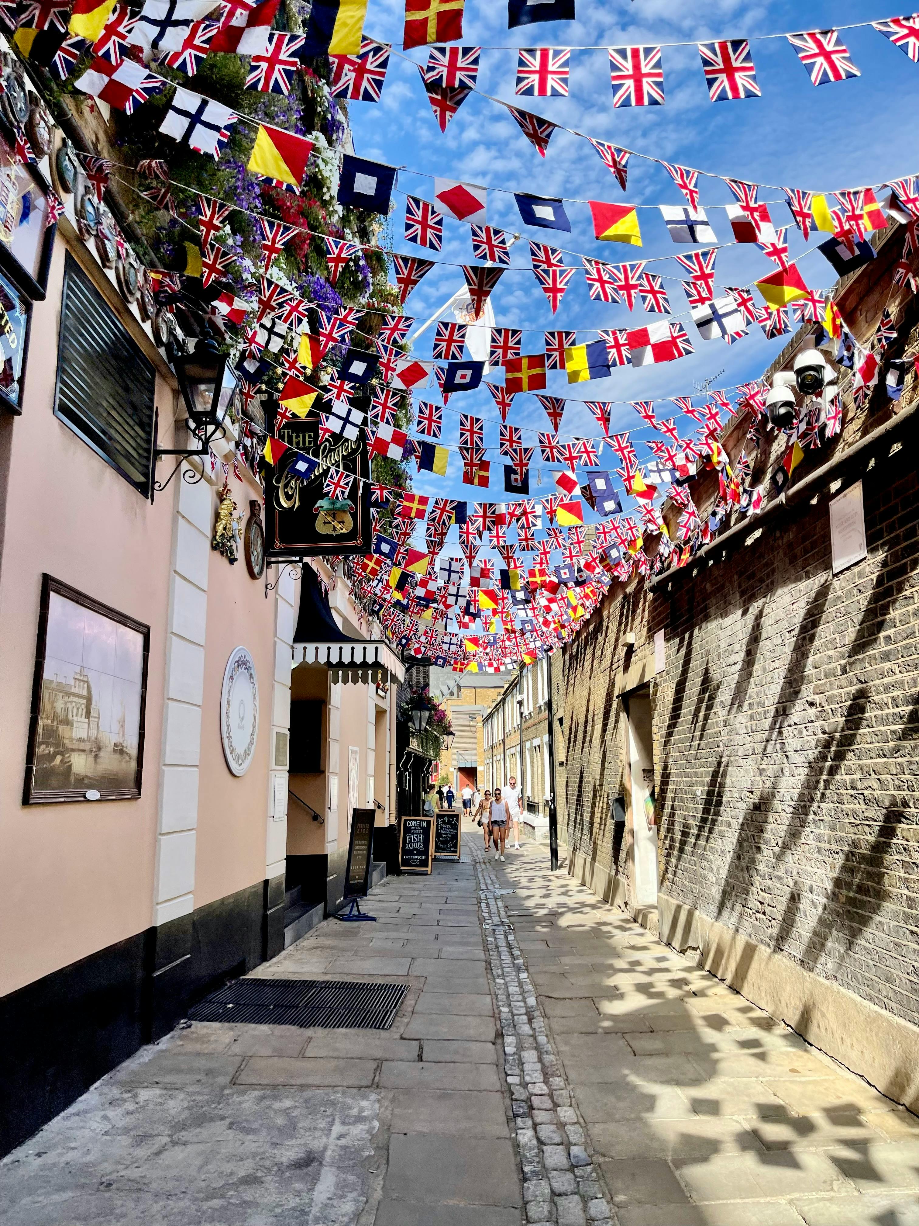 A Street with Hanging Flags · Free Stock Photo