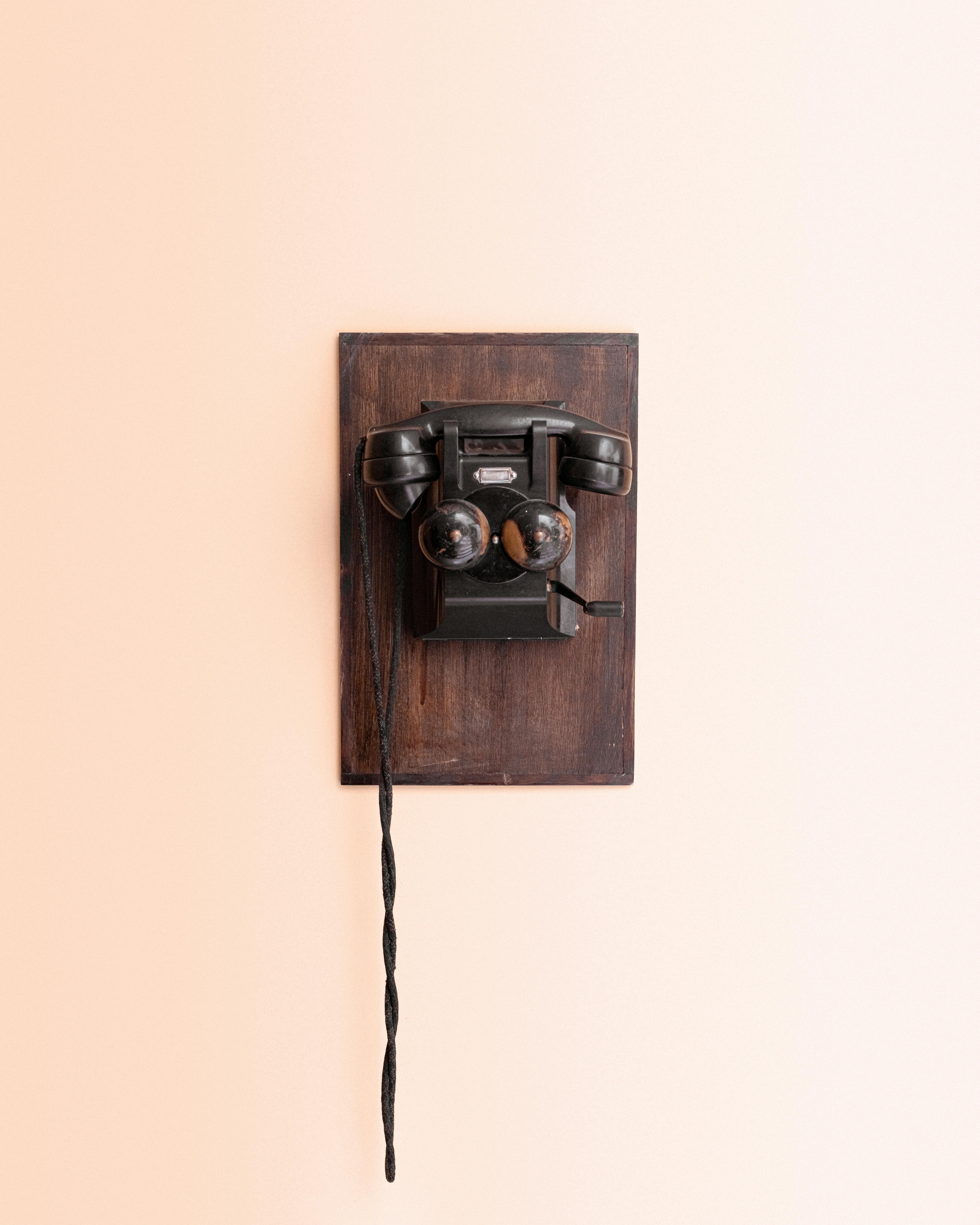 A Black Telephone on the Wall · Free Stock Photo