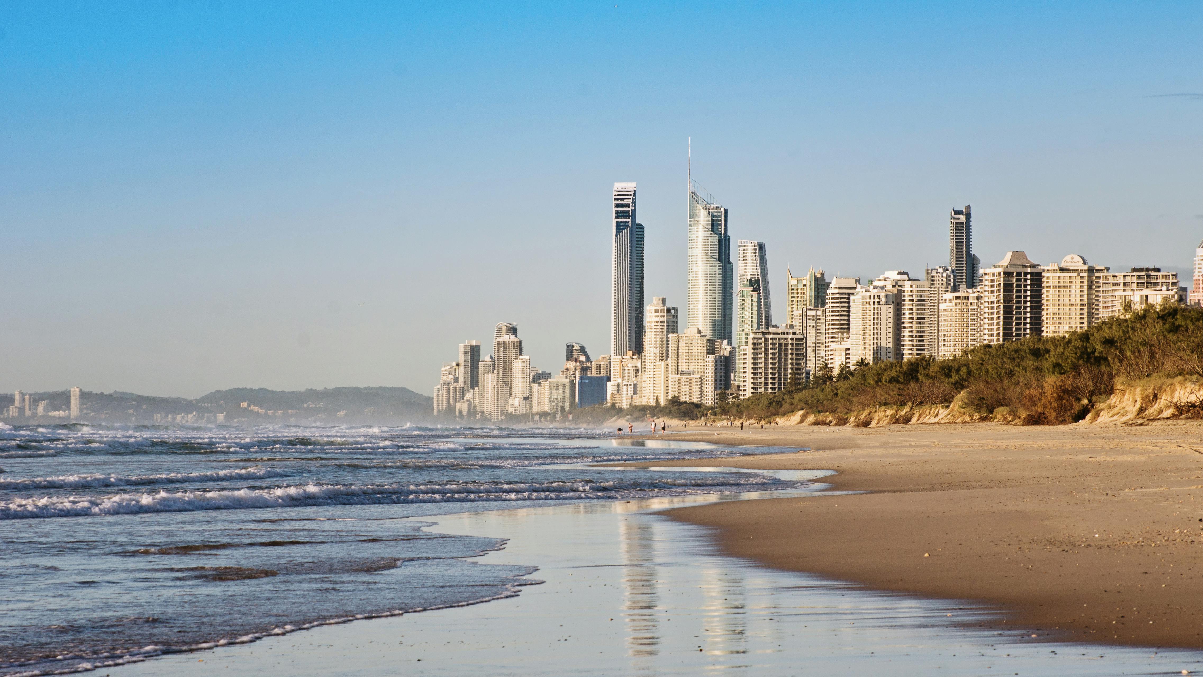 Closeup Photo of Seashore Near Bridge · Free Stock Photo