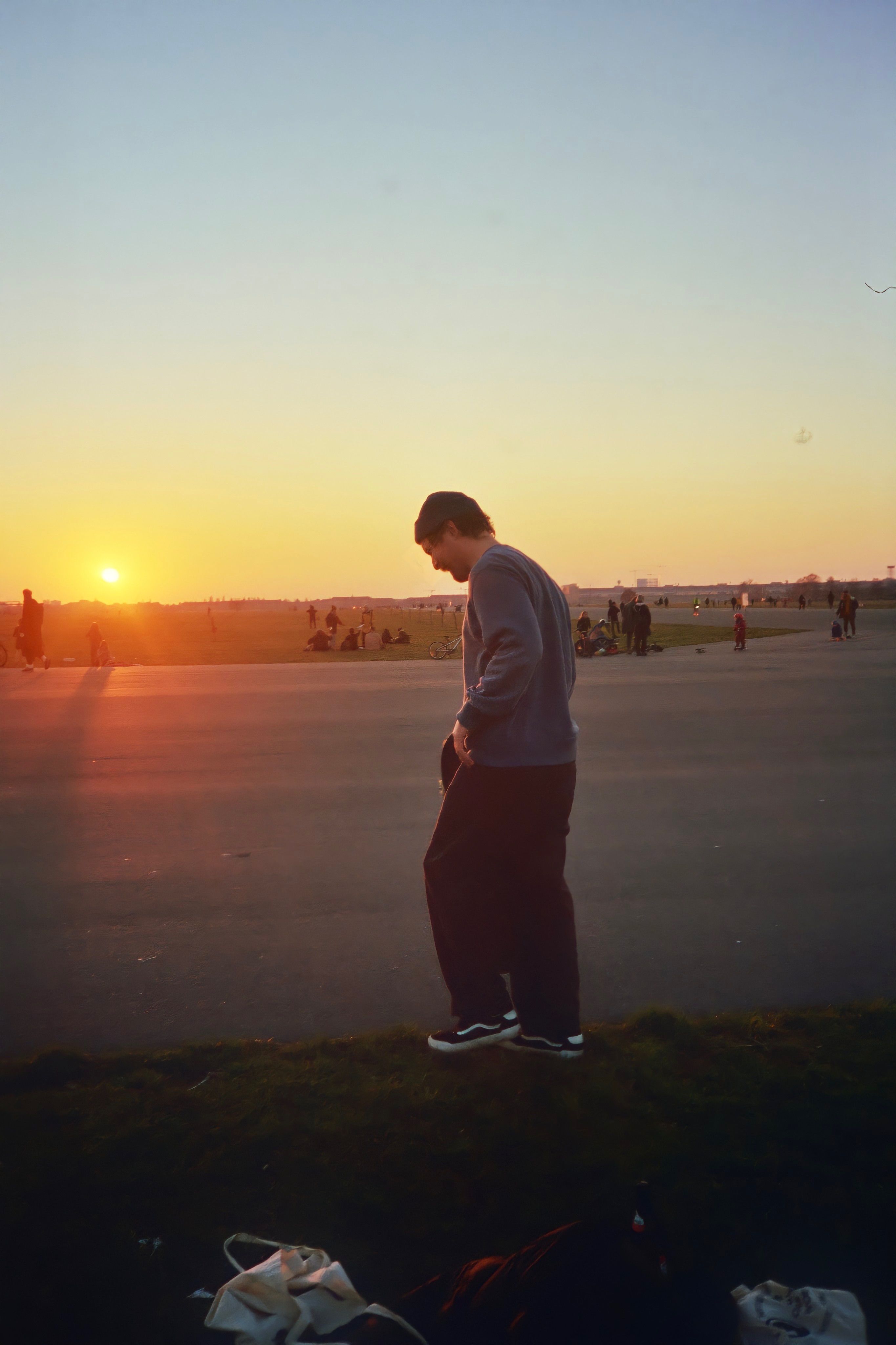 A Man in a Blue Sweater and Black Pants at a Park during the Golden ...