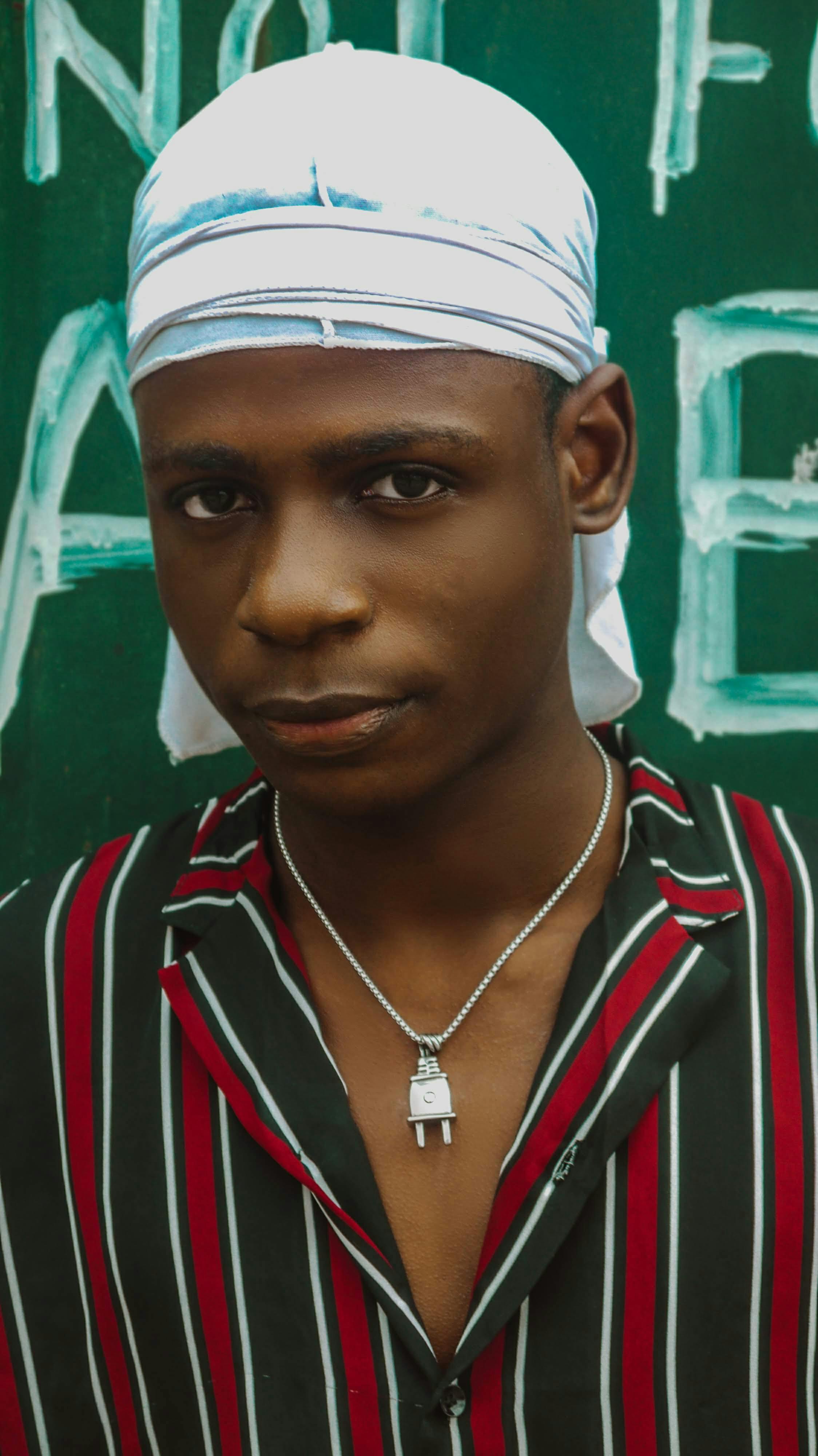 Portrait of a Man With a Durag and a Necklace · Free Stock Photo