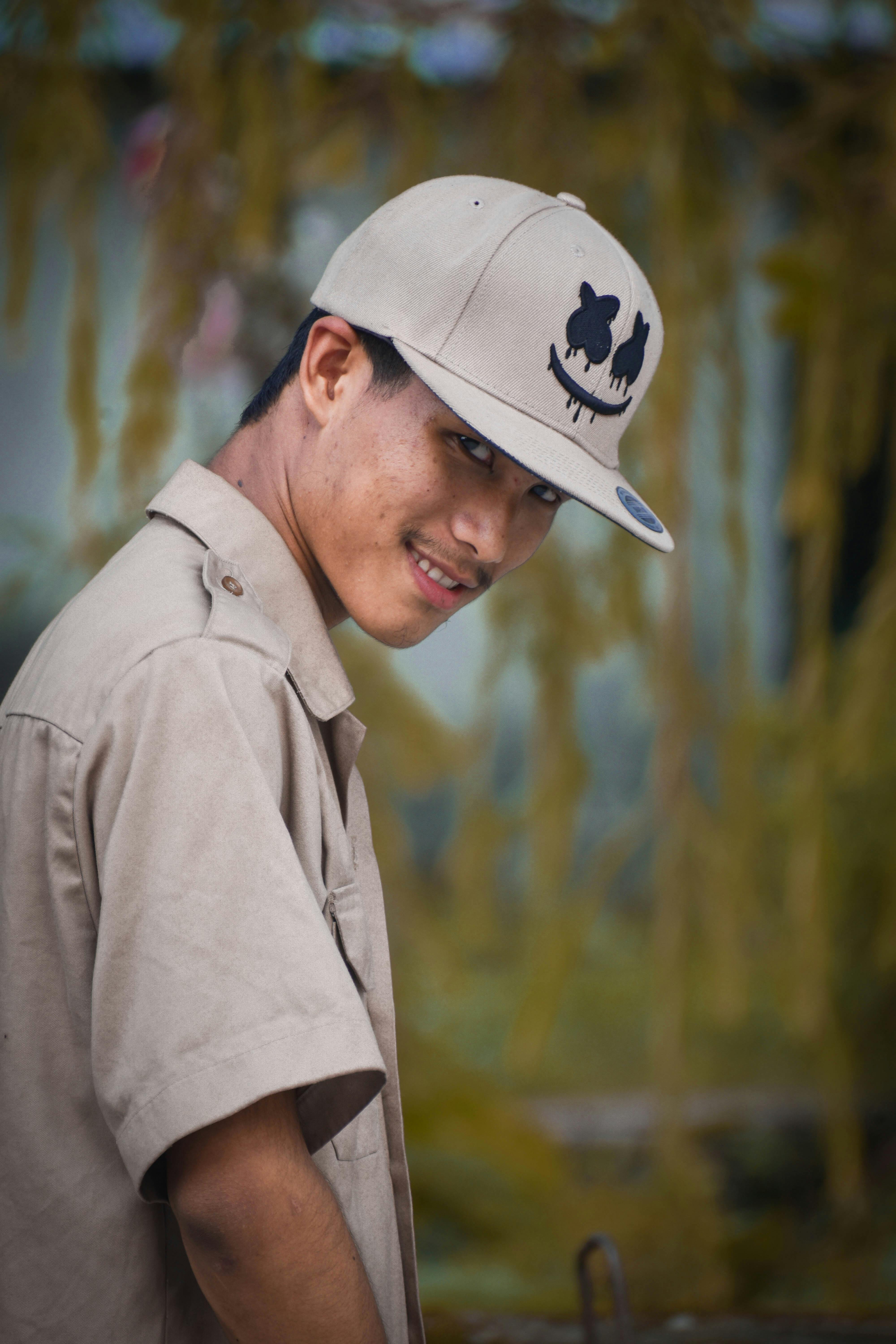 Two Men Wearing Caps · Free Stock Photo