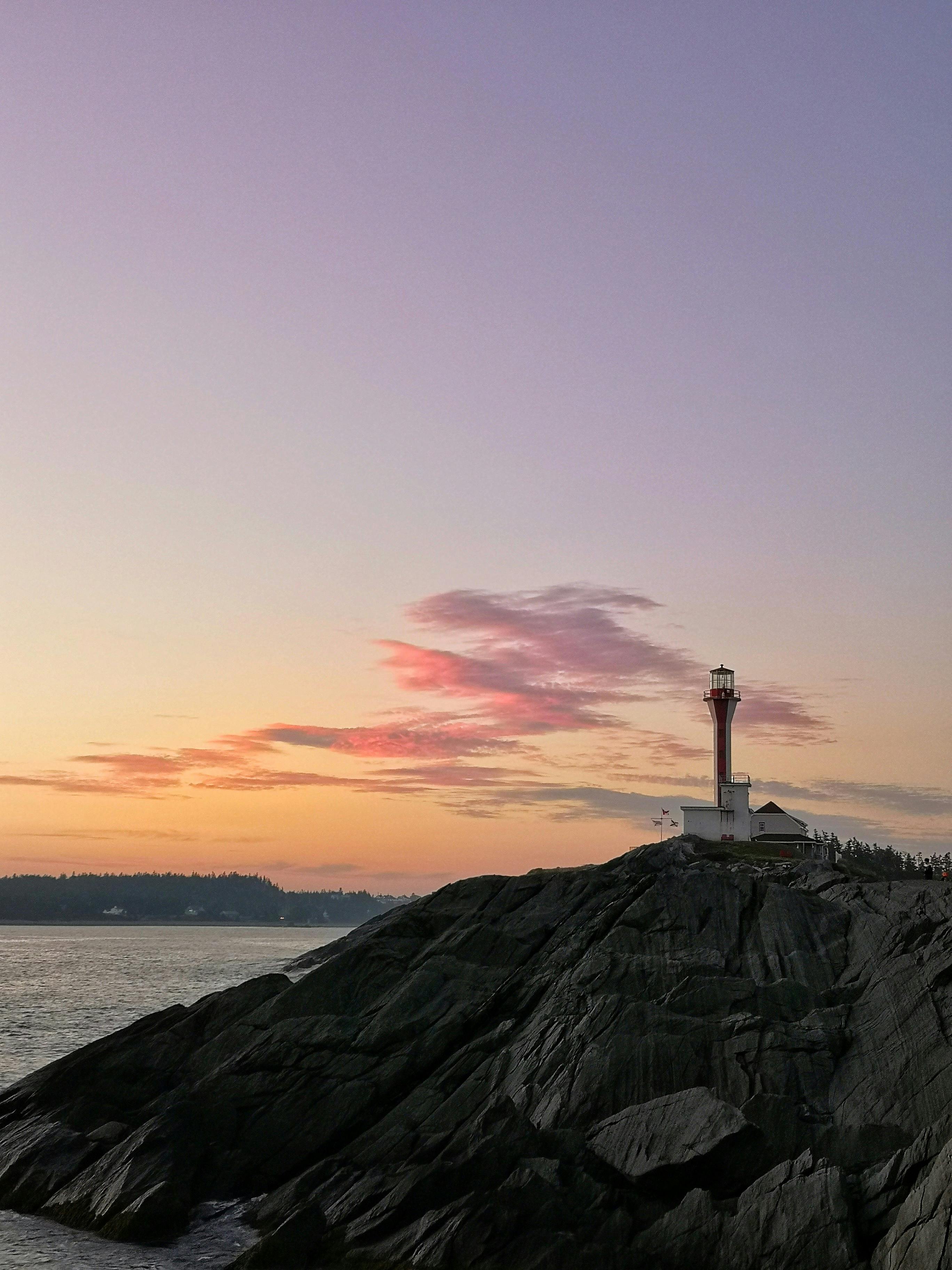 Lighthouse Beside the Ocean · Free Stock Photo