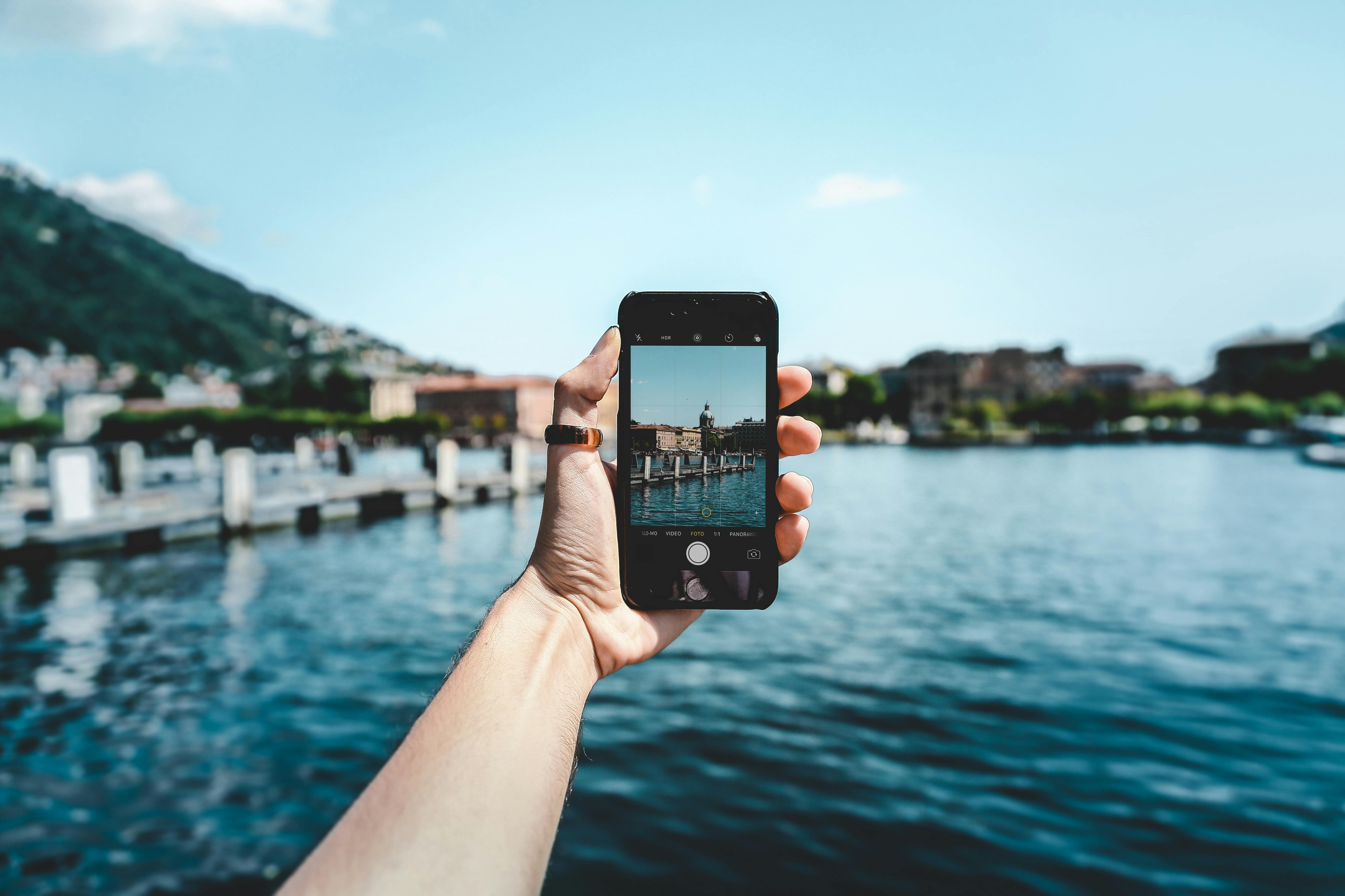 Hand Holding Phone Taking Photograph · Free Stock Photo