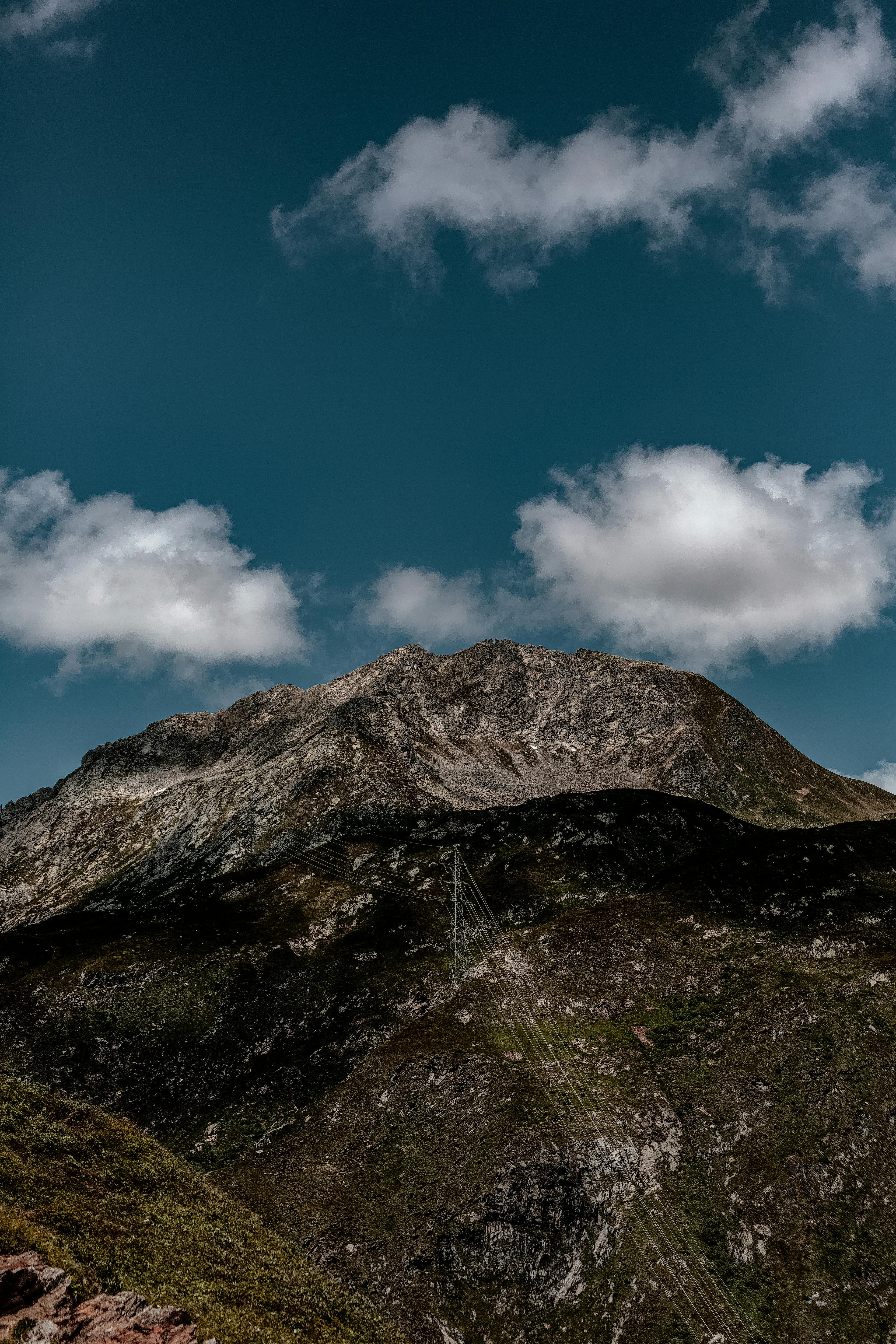 Brown Rock Mountains Under the White Clouds · Free Stock Photo