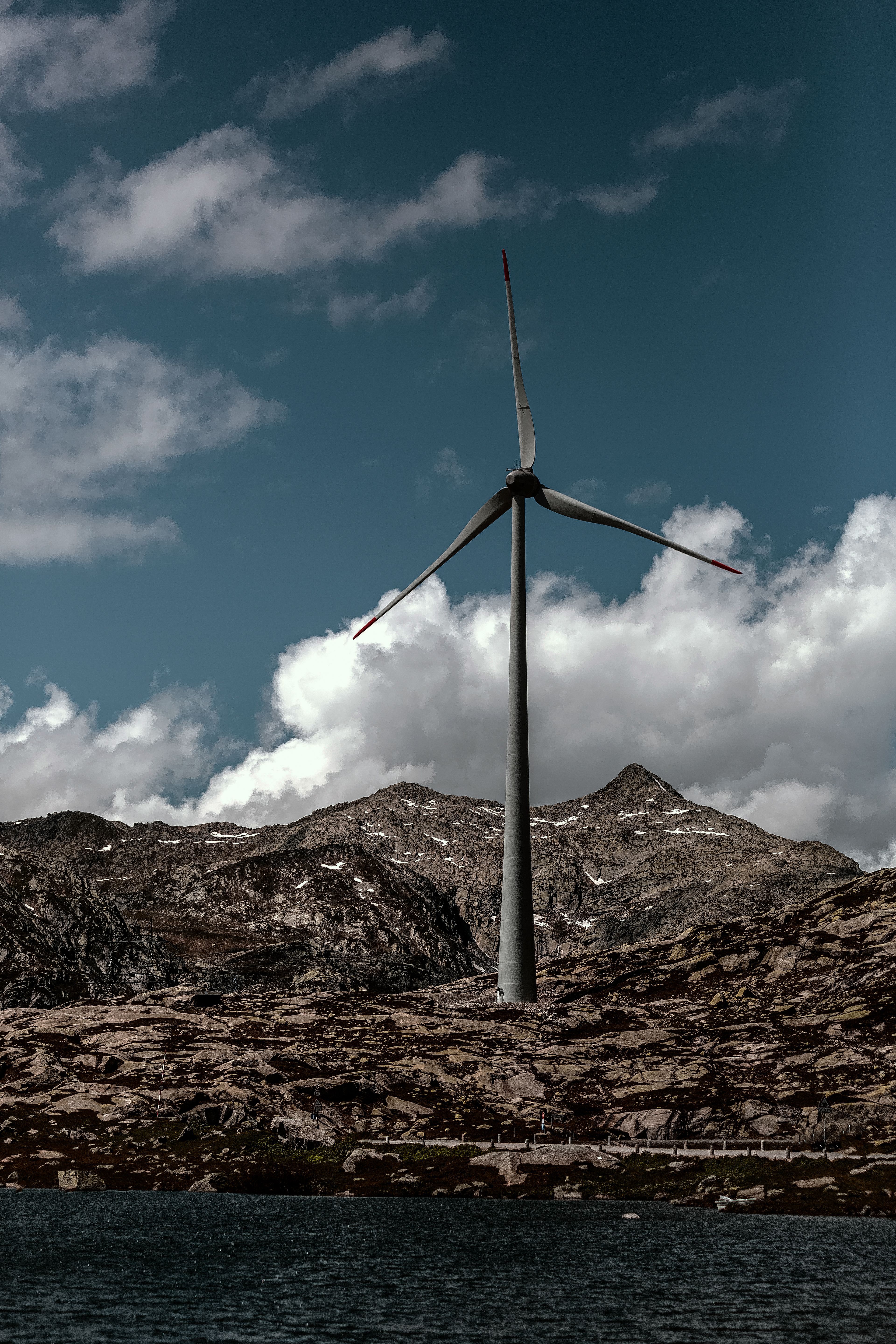 Wind Turbine on Mountain Under Blue Sky · Free Stock Photo