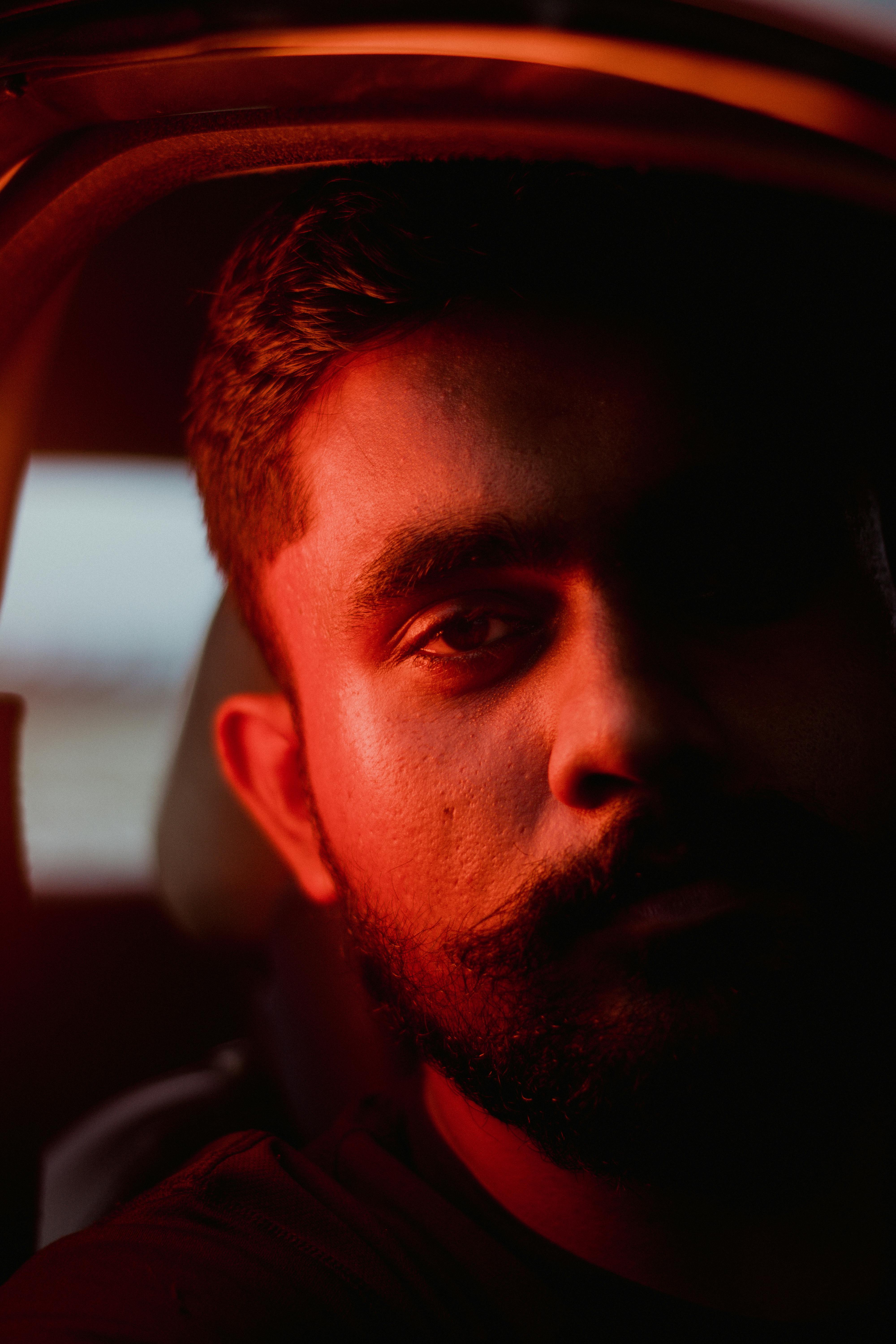 A Mans Face with a Red Light · Free Stock Photo