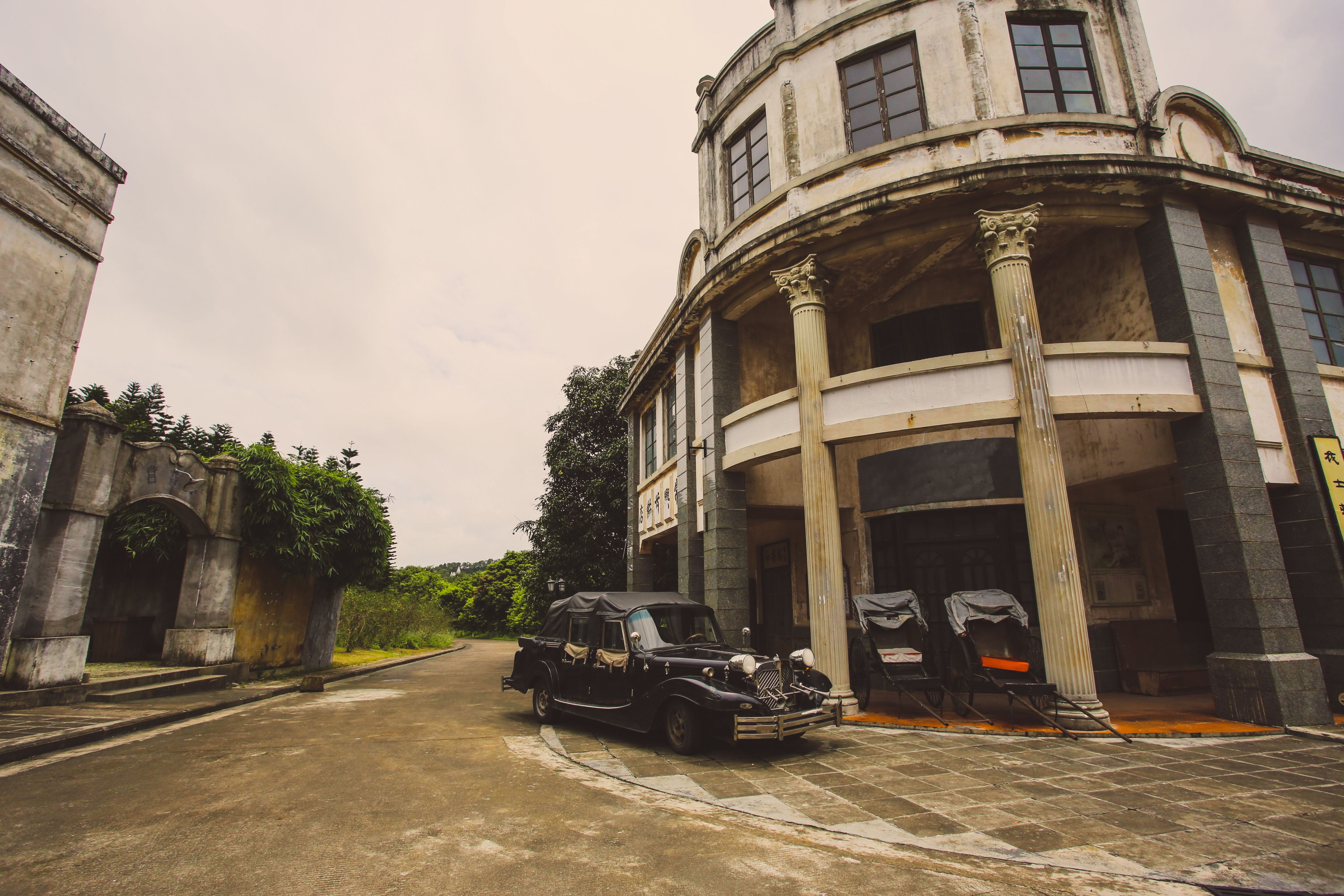 A Parked Car Outside the Building · Free Stock Photo