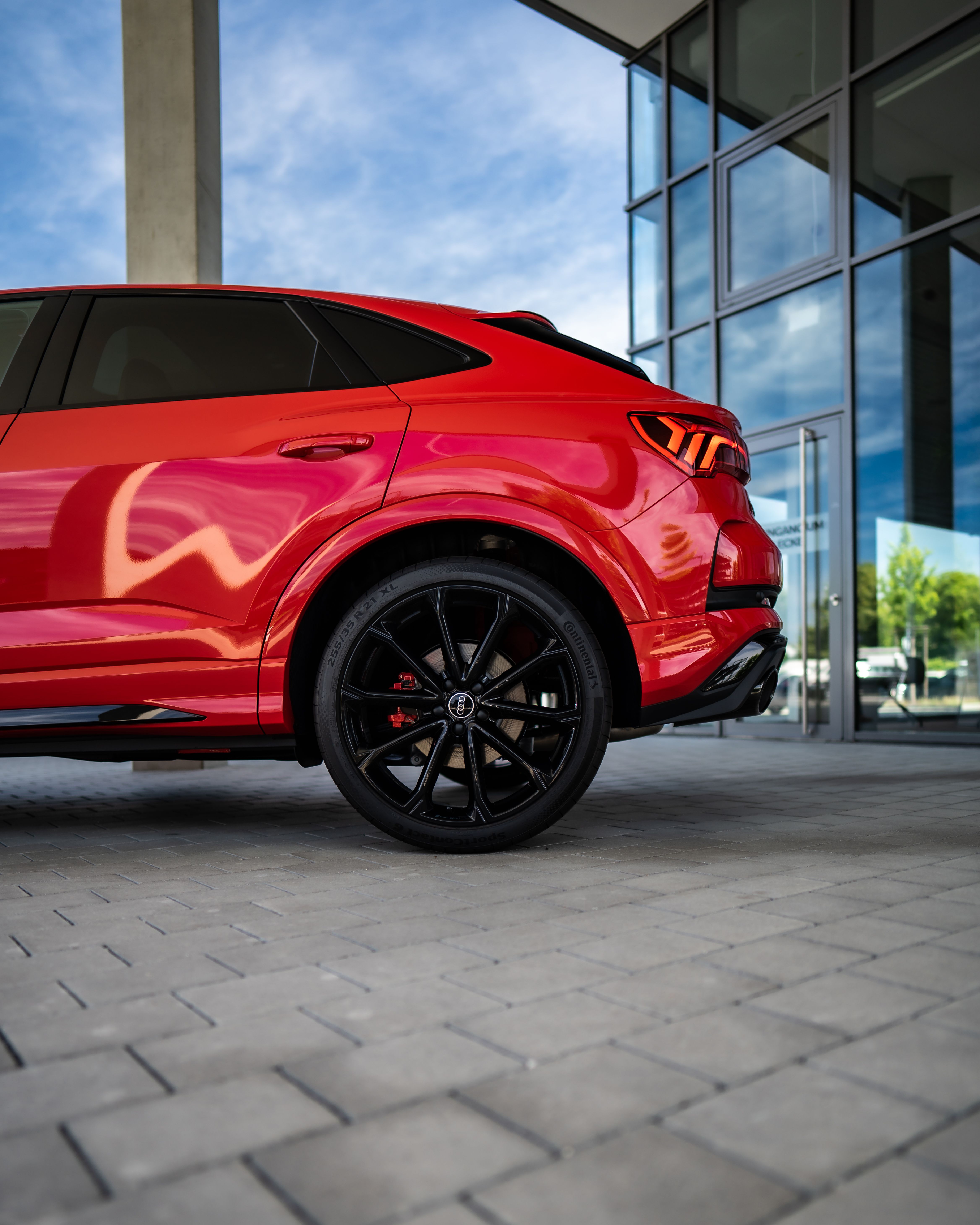 Red Car Parked on Cobblestone Street · Free Stock Photo