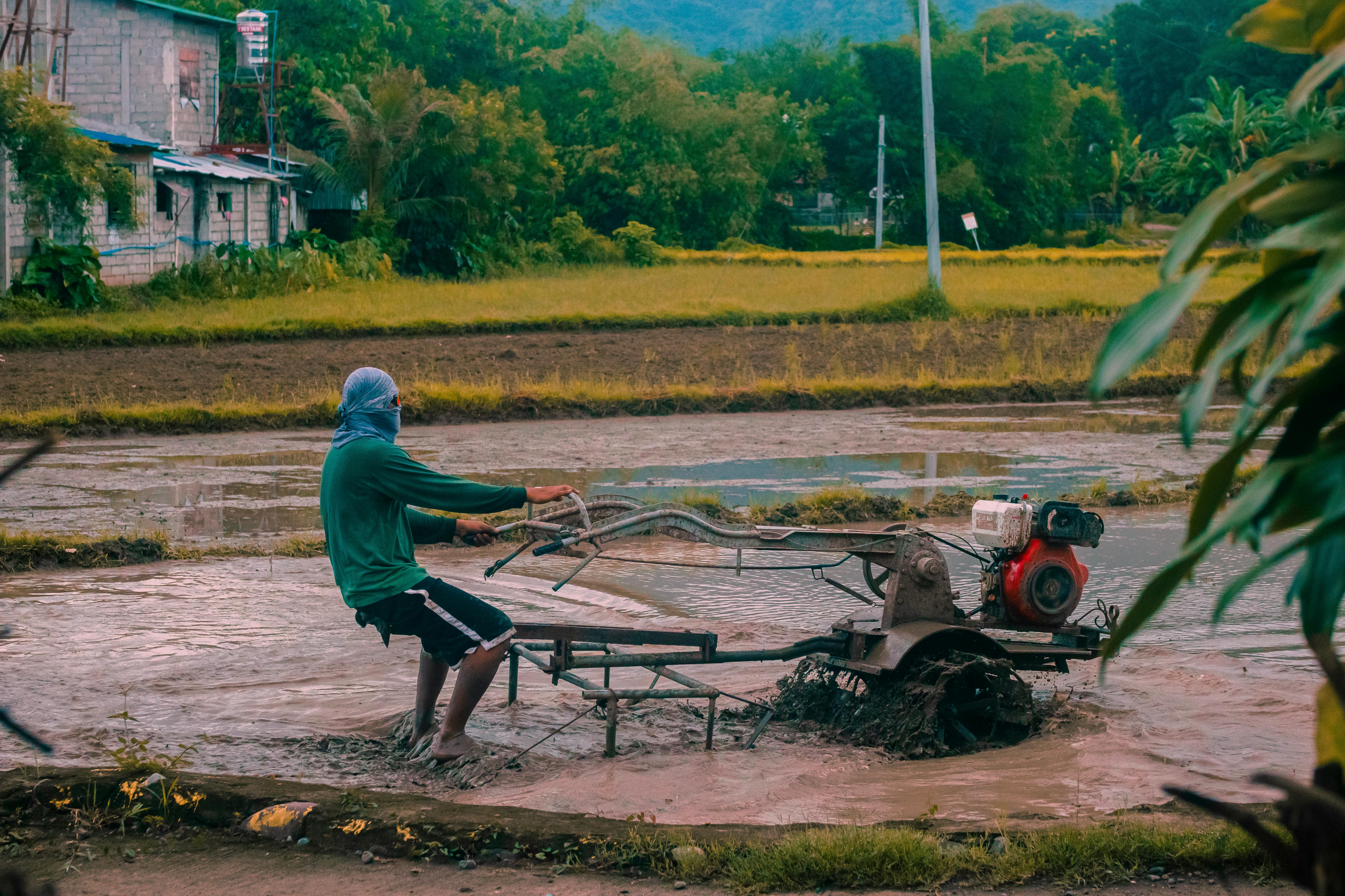 A Man Using Hand Plow Machine · Free Stock Photo