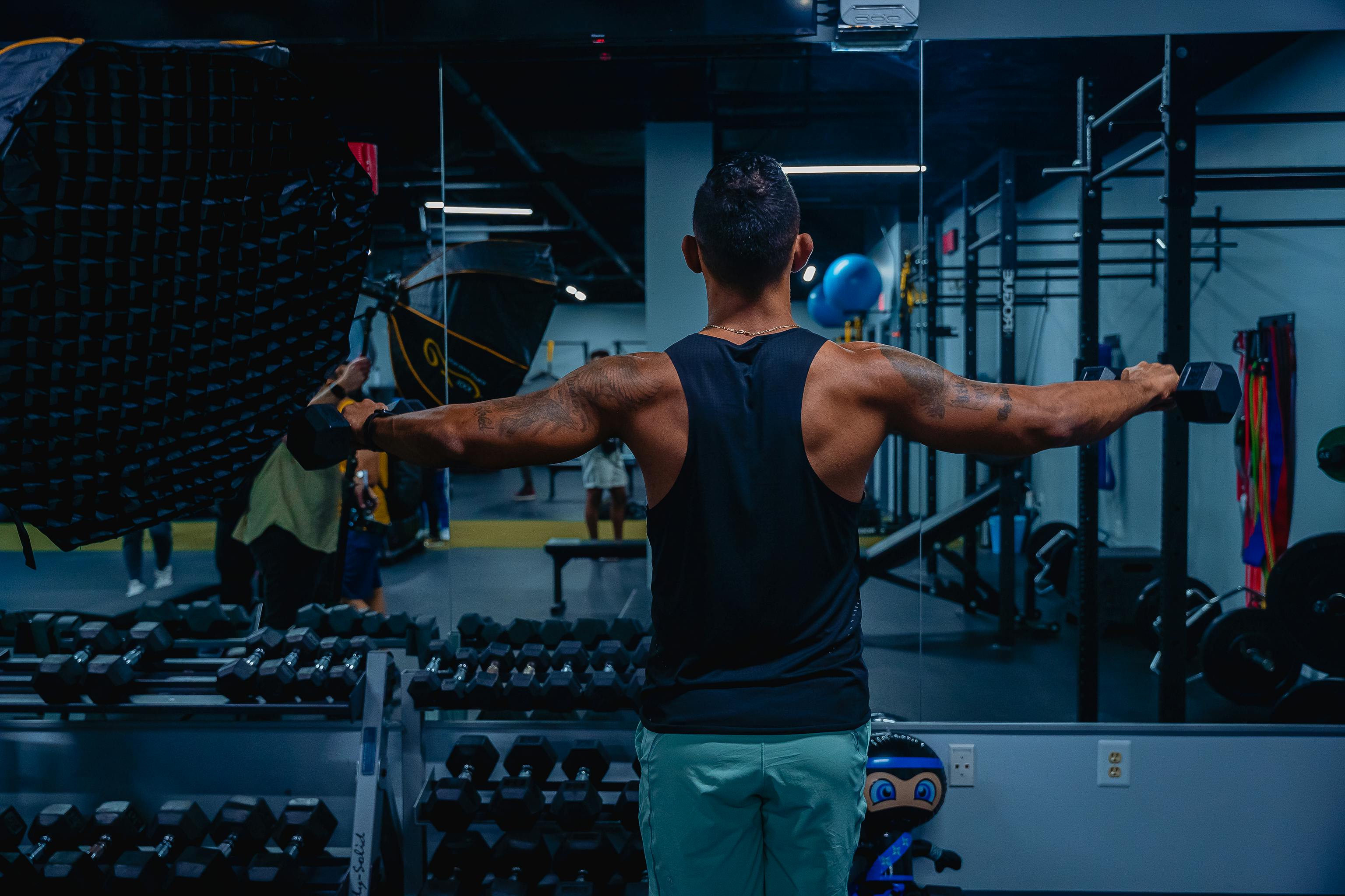 Woman Lifting a Dumbbell · Free Stock Photo