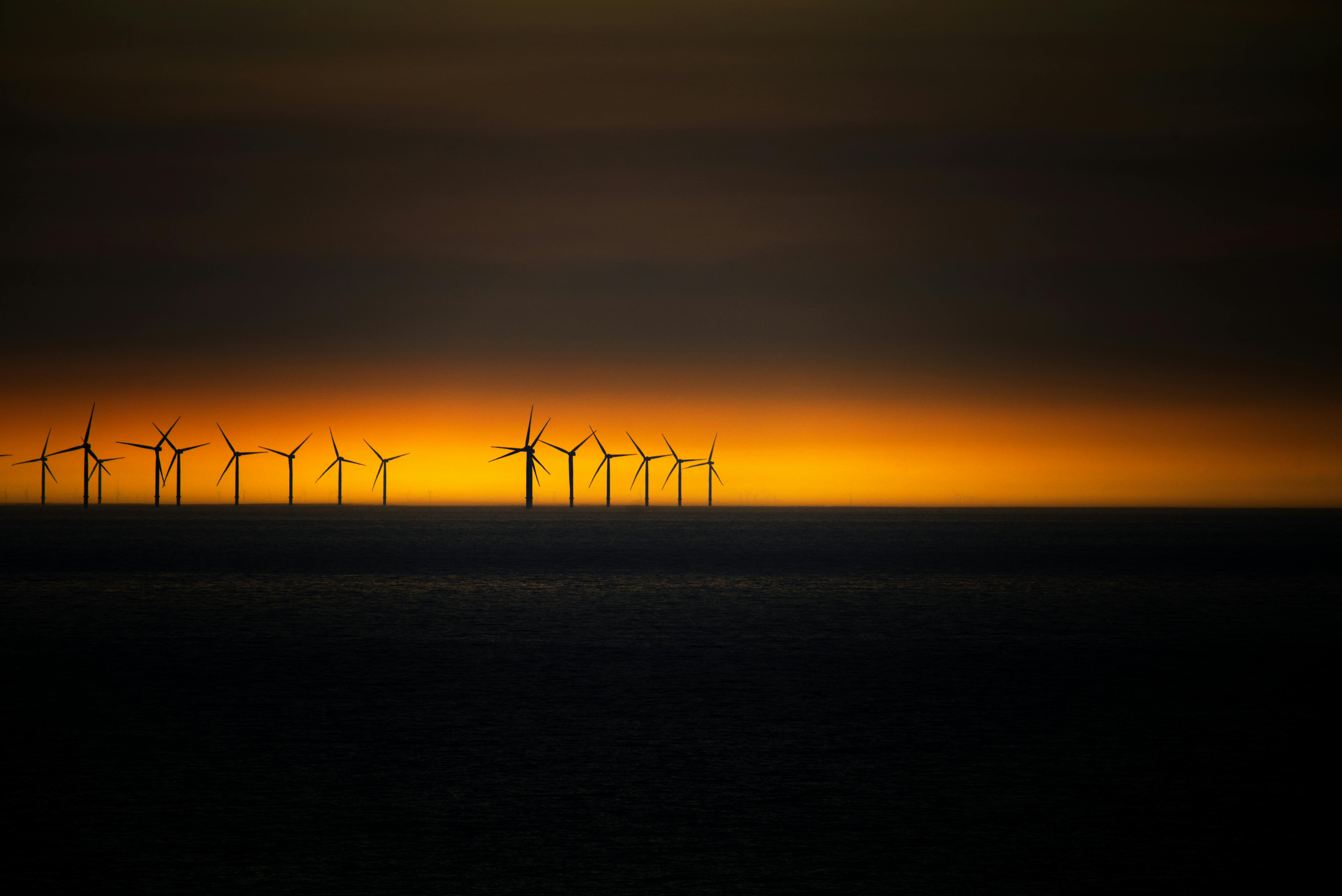 Gray Wind Turbine Under Blue Sky · Free Stock Photo