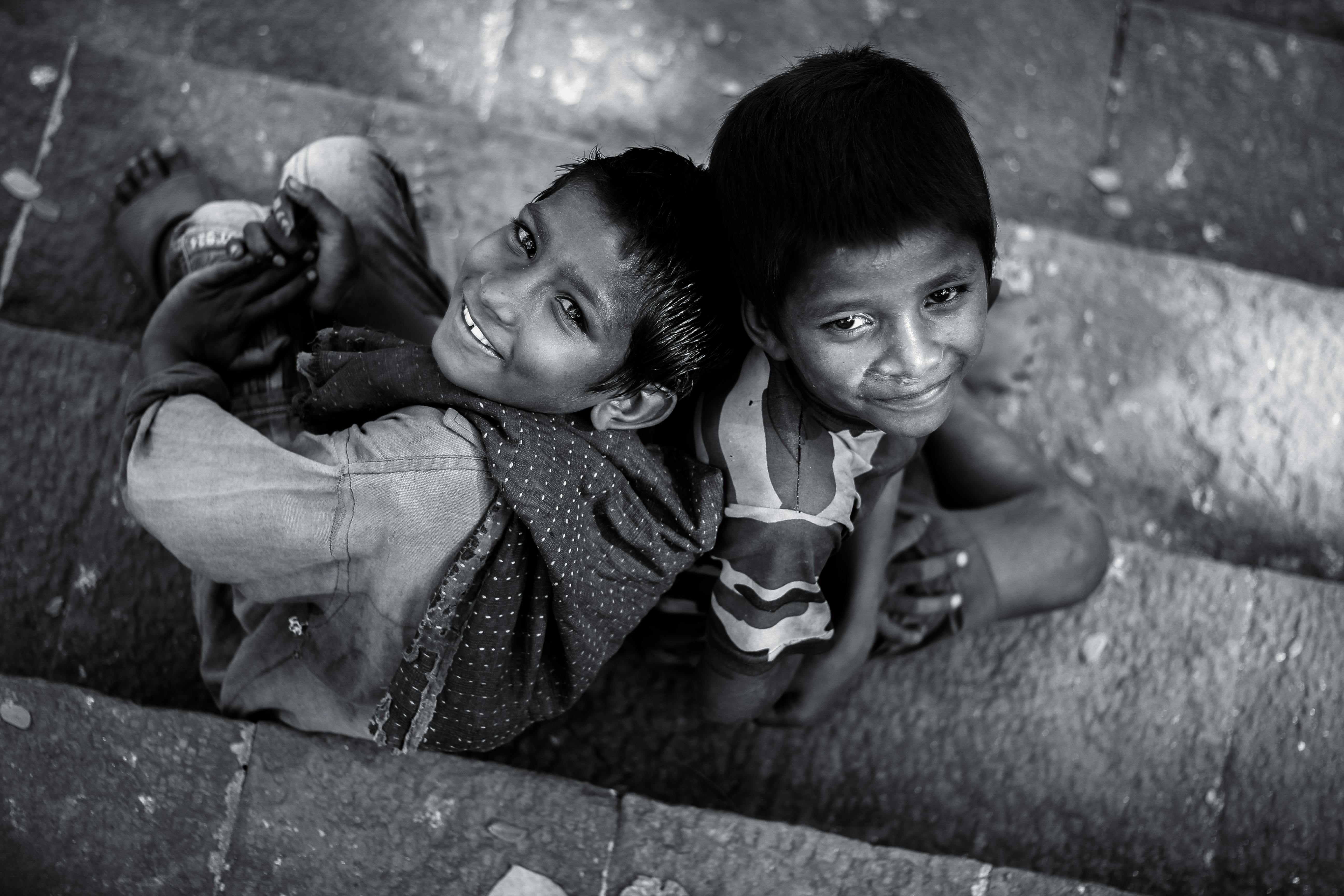 High Angle Shot of a Two Boys Sitting on the Floor · Free Stock Photo