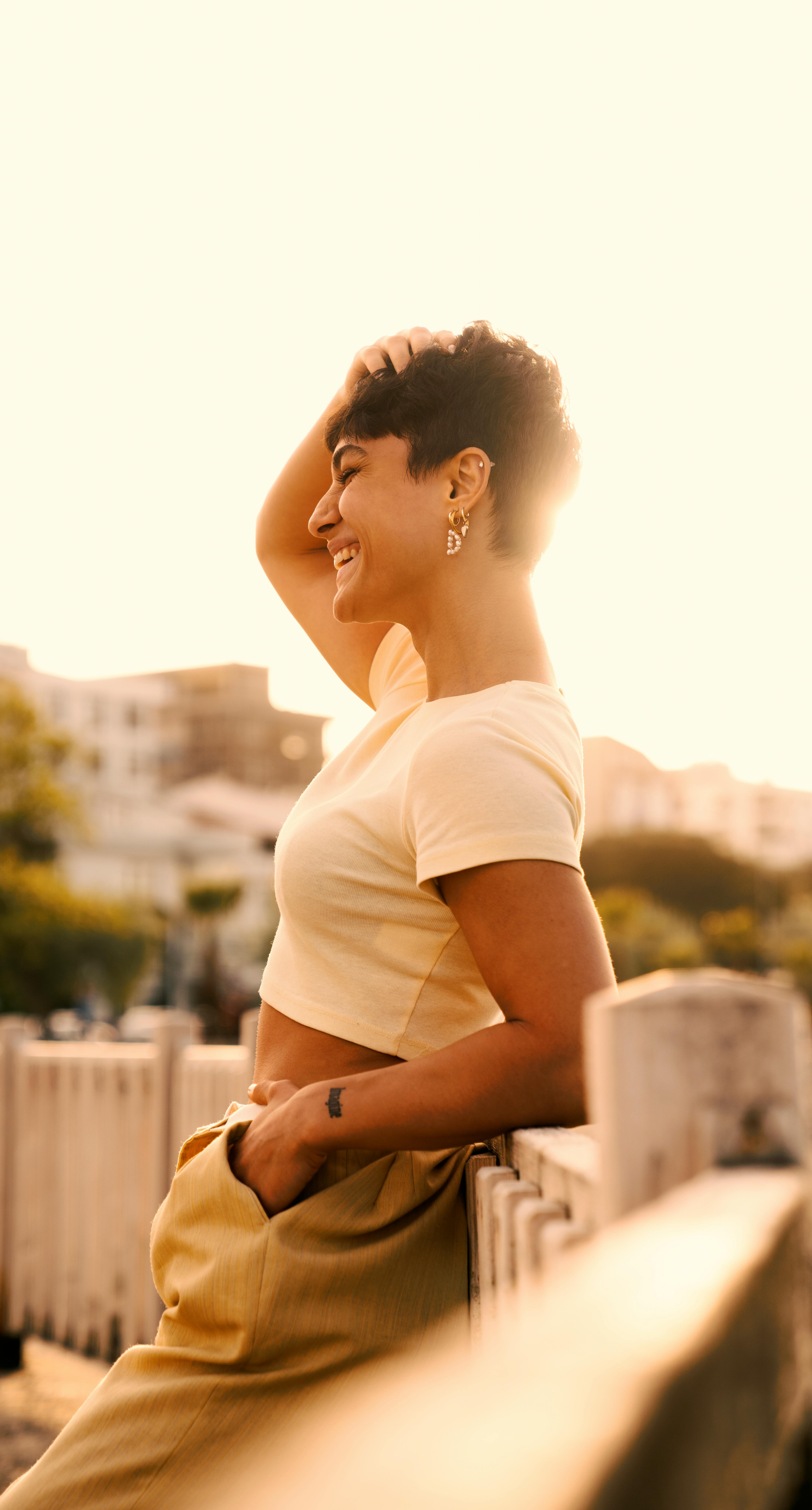 Smiling Woman Posing in front of Yellow Corrugated Steel Fence · Free ...