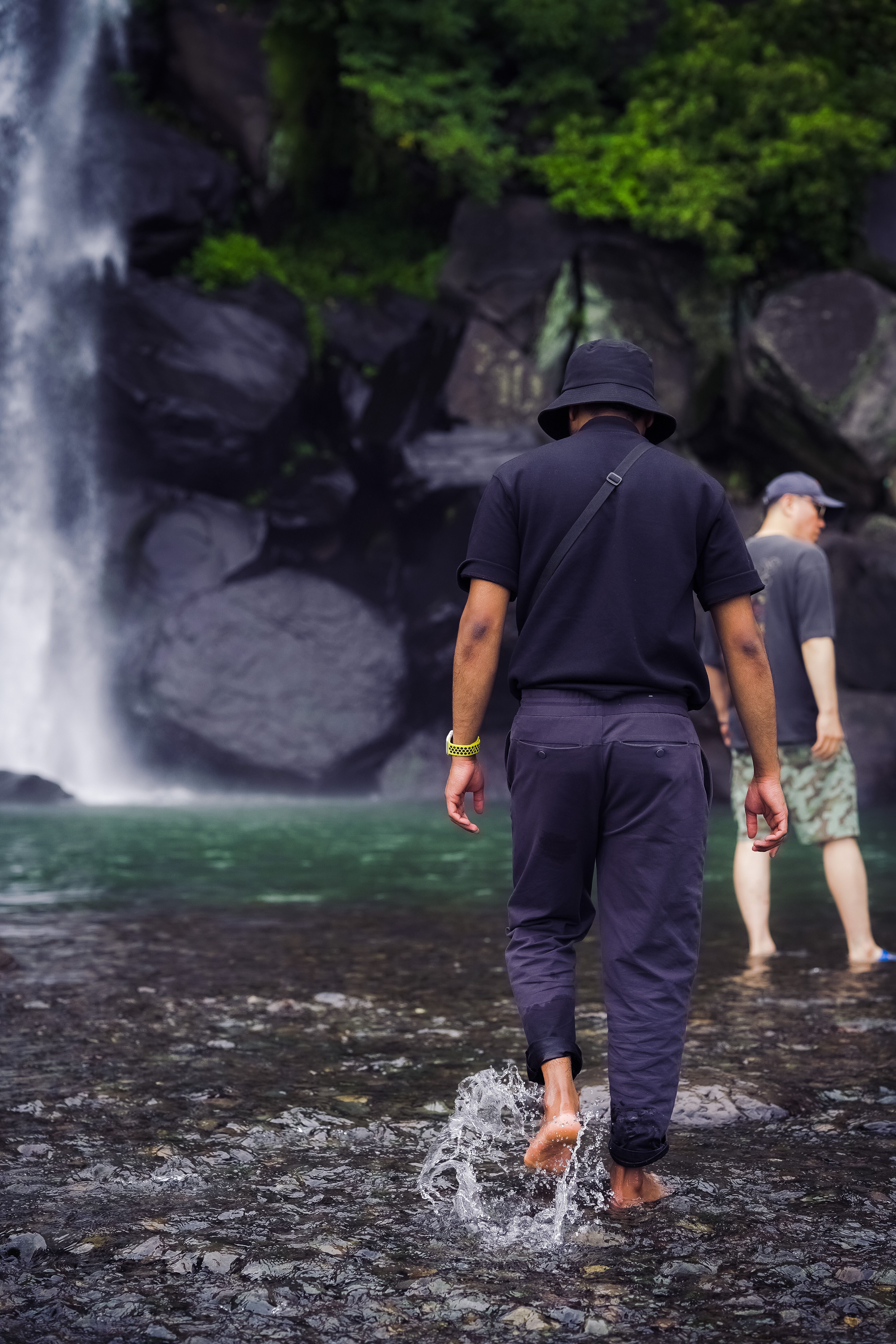 A Man Walking Near the Waterfall · Free Stock Photo