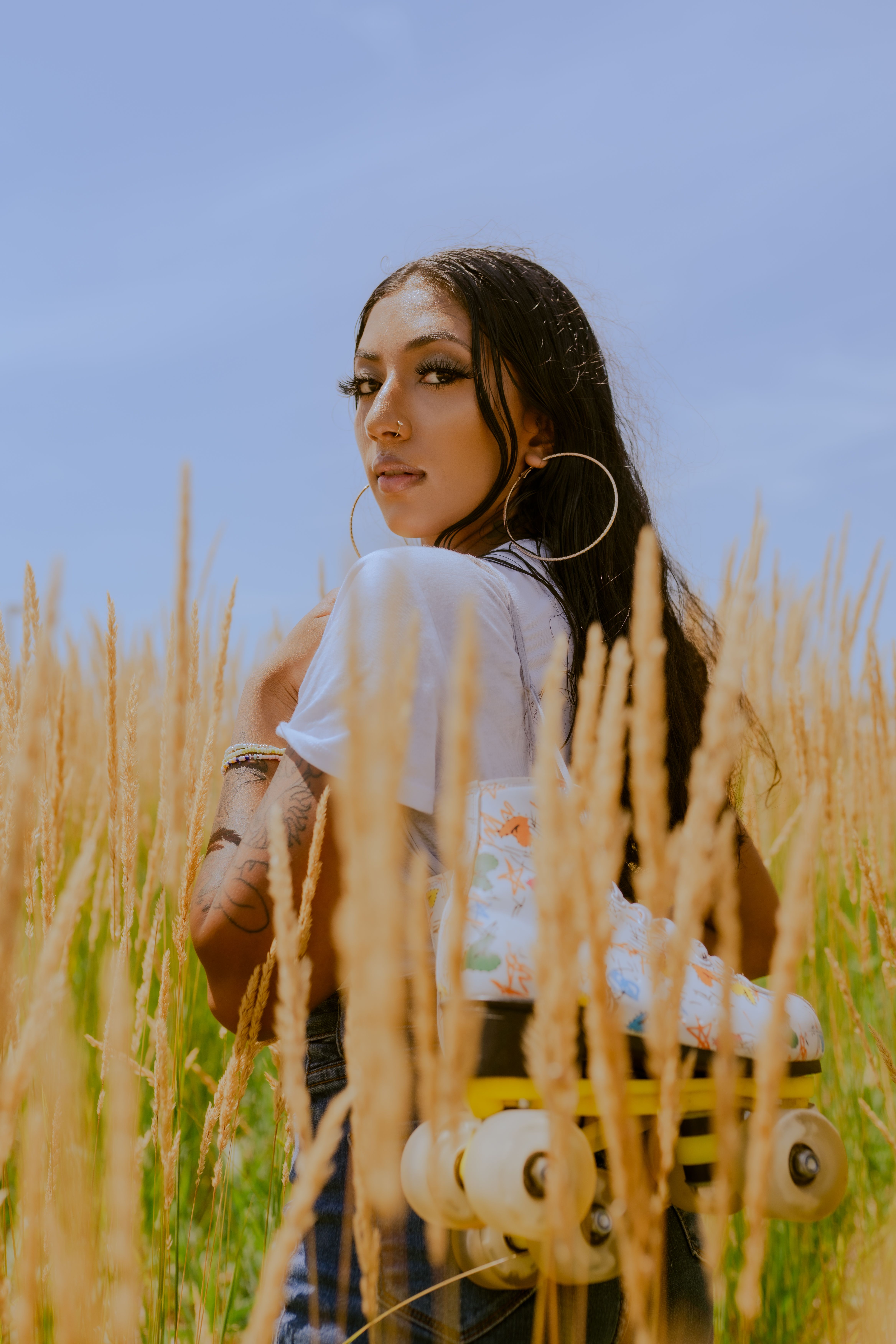 A Woman Walking on Grass Field · Free Stock Photo