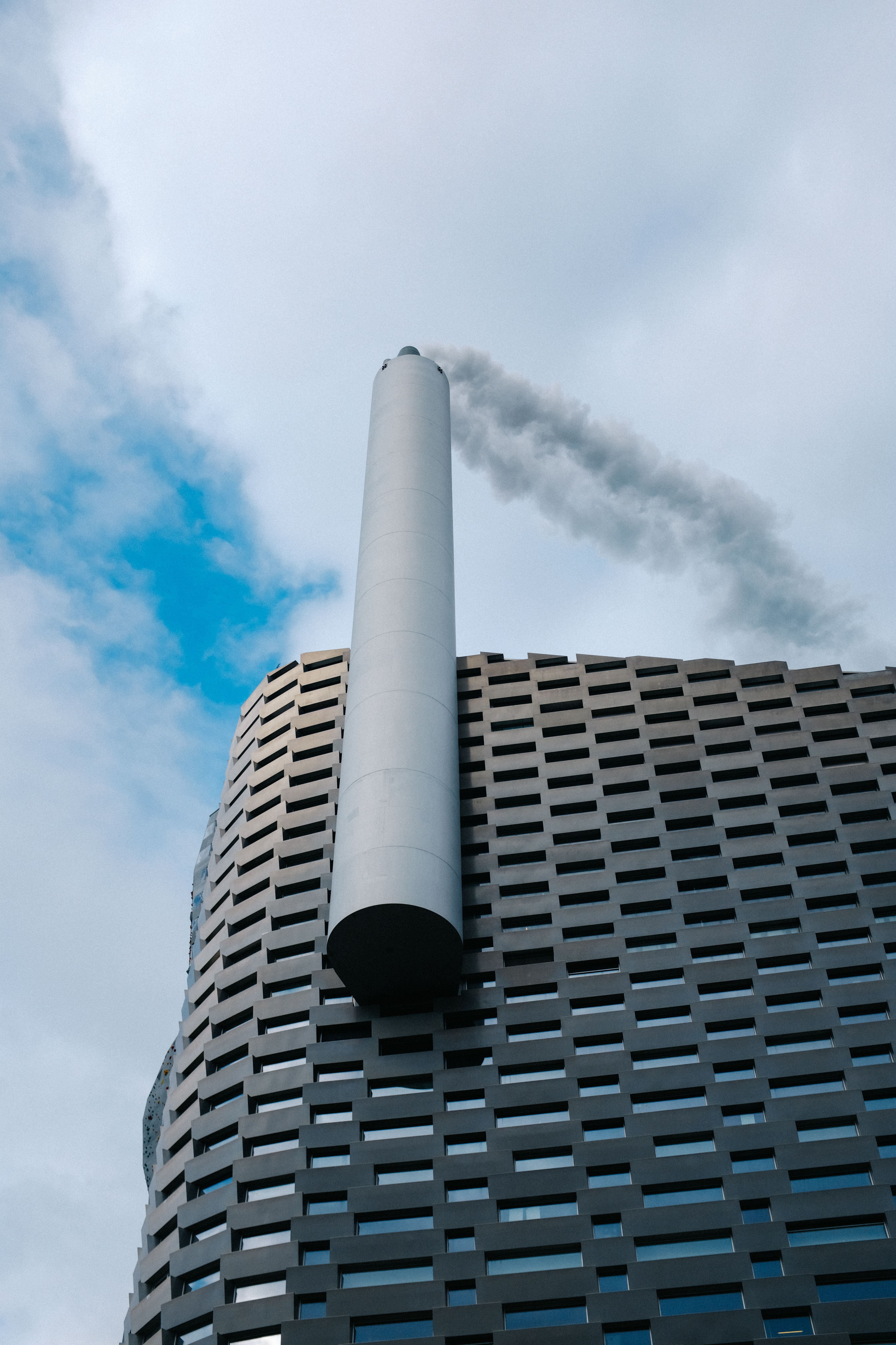 A Stainless Steel Industrial Chimney Emitting Smoke on Dark Sky · Free ...