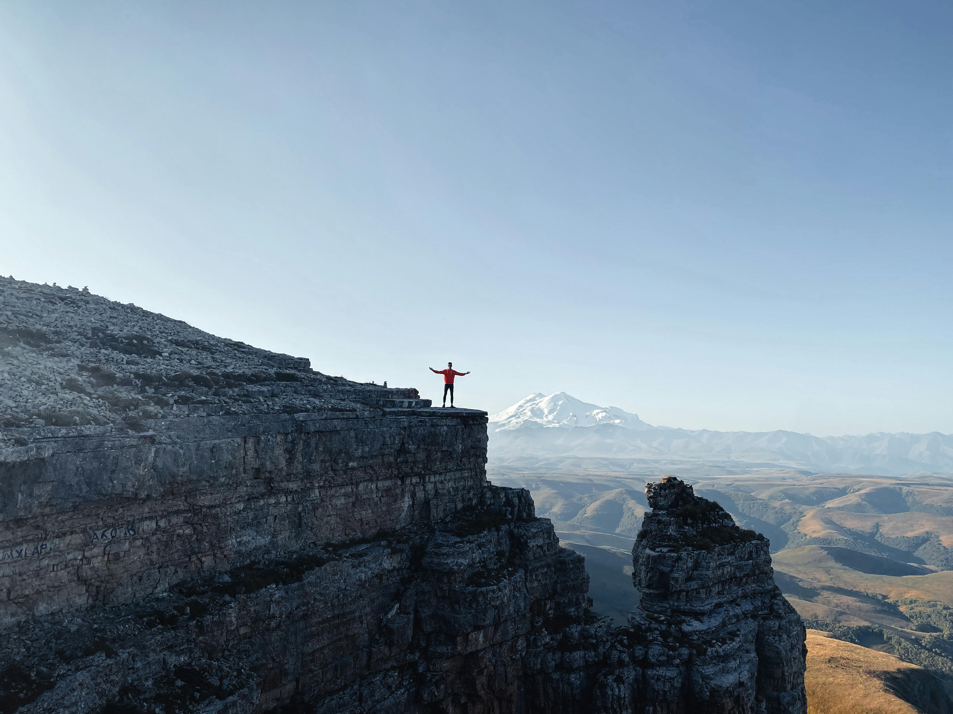 A Person Standing on the Cliff · Free Stock Photo