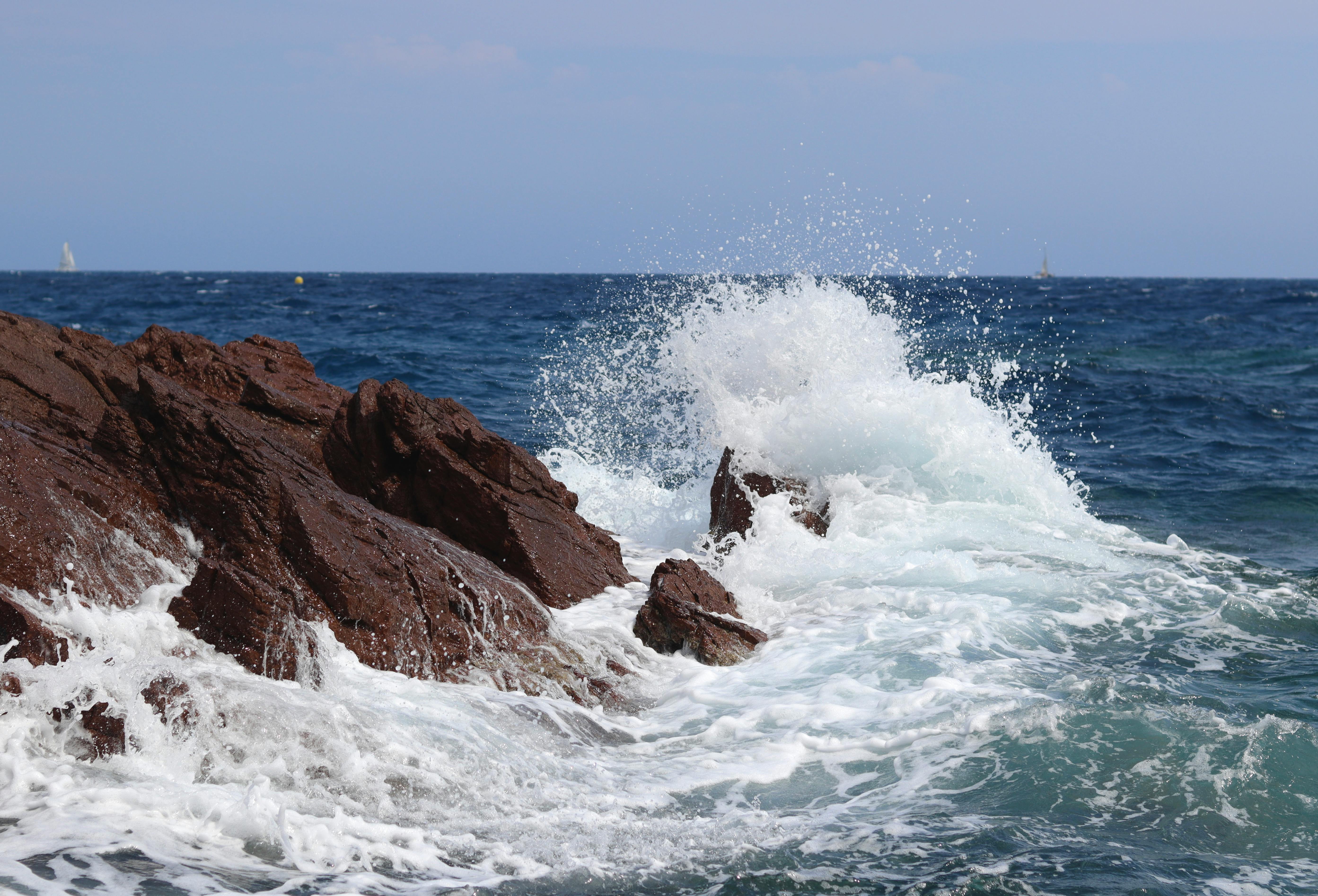 Ocean Waves Crashing on a Rock Formation · Free Stock Photo