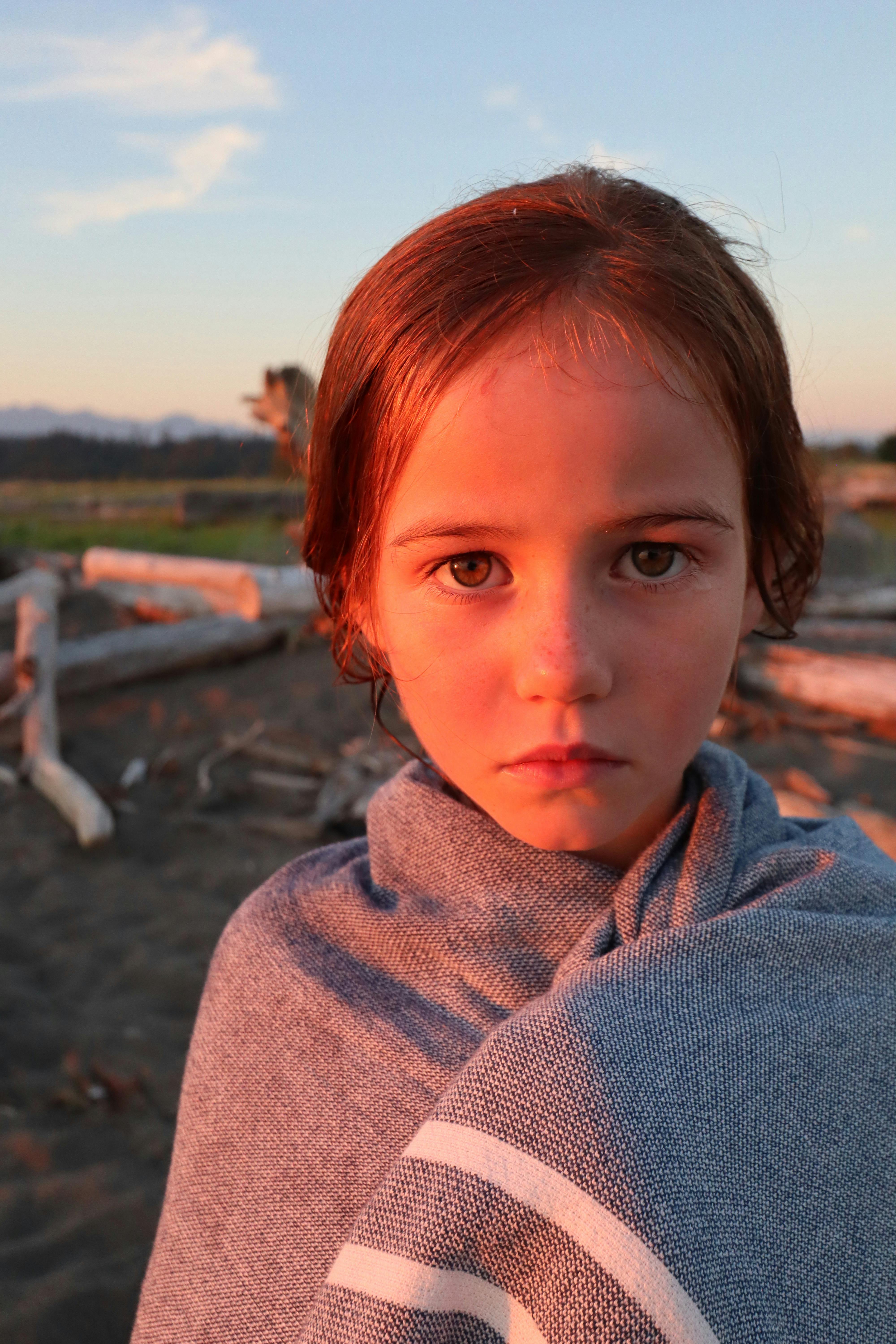 Little Boy Wrapped in a Towel Crying Beside a Wall · Free Stock Photo