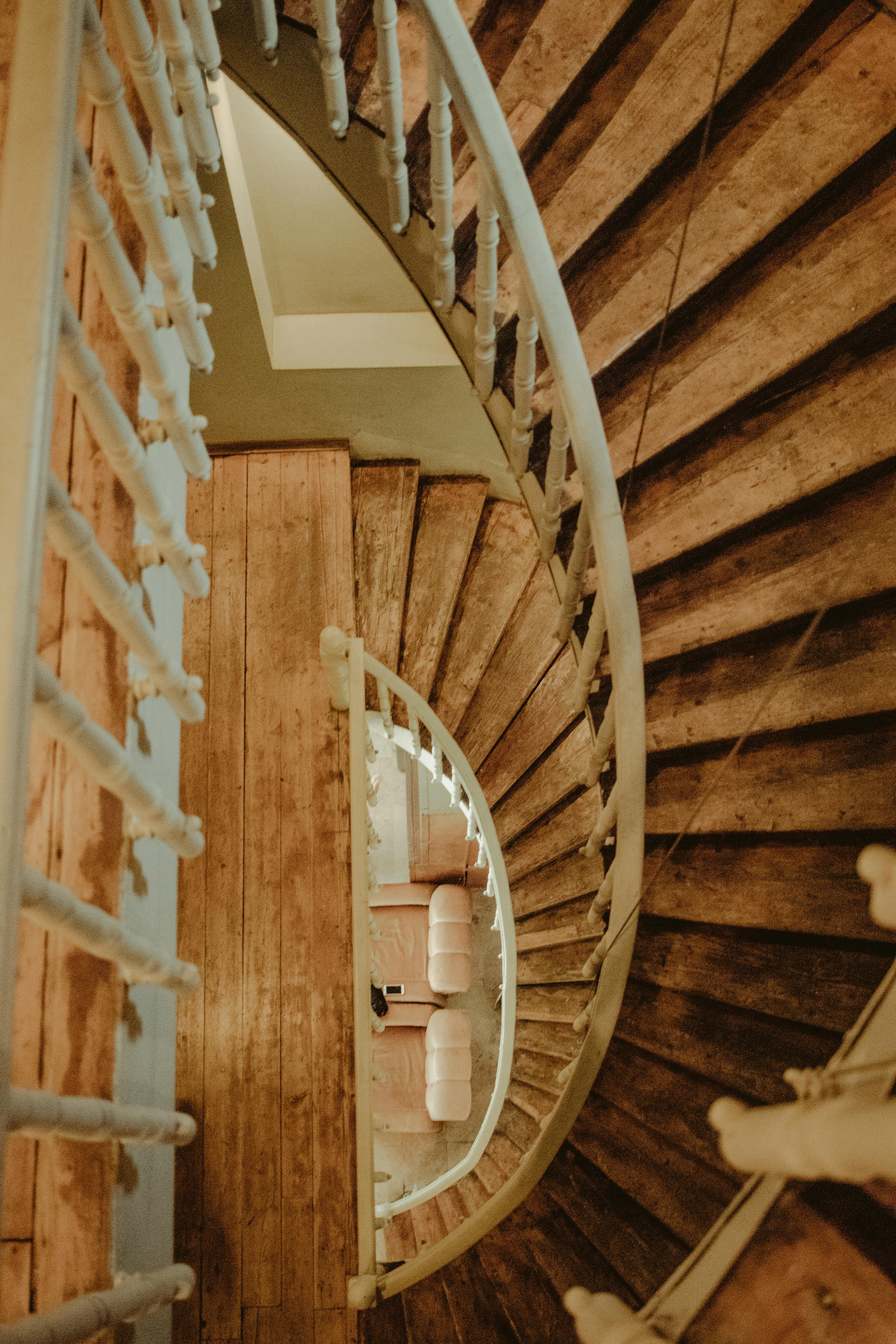 Brown Wooden Spiral Staircase With White Wooden Railings · Free Stock Photo