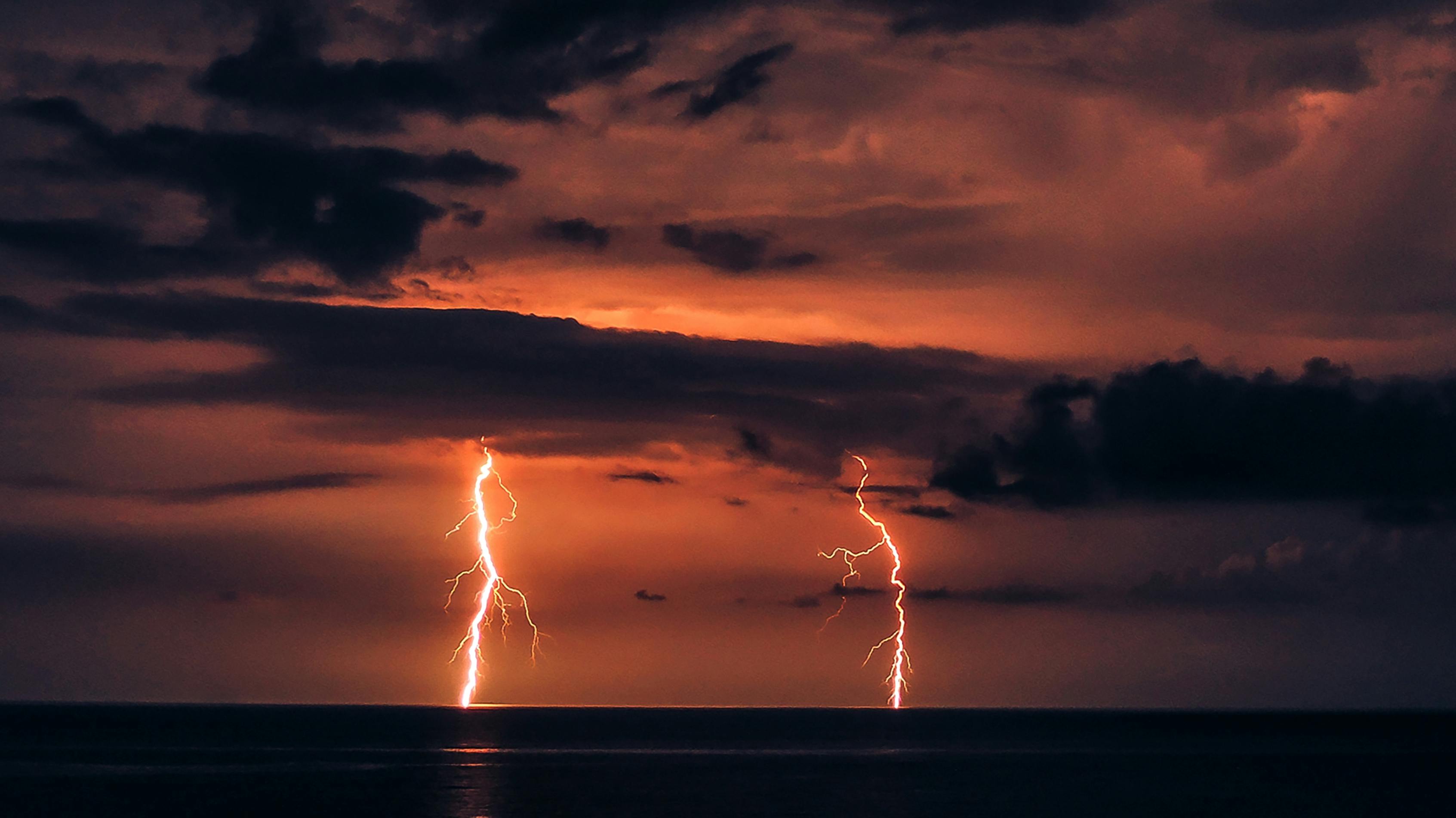 Lightning Strikes in the Ocean at Night · Free Stock Photo
