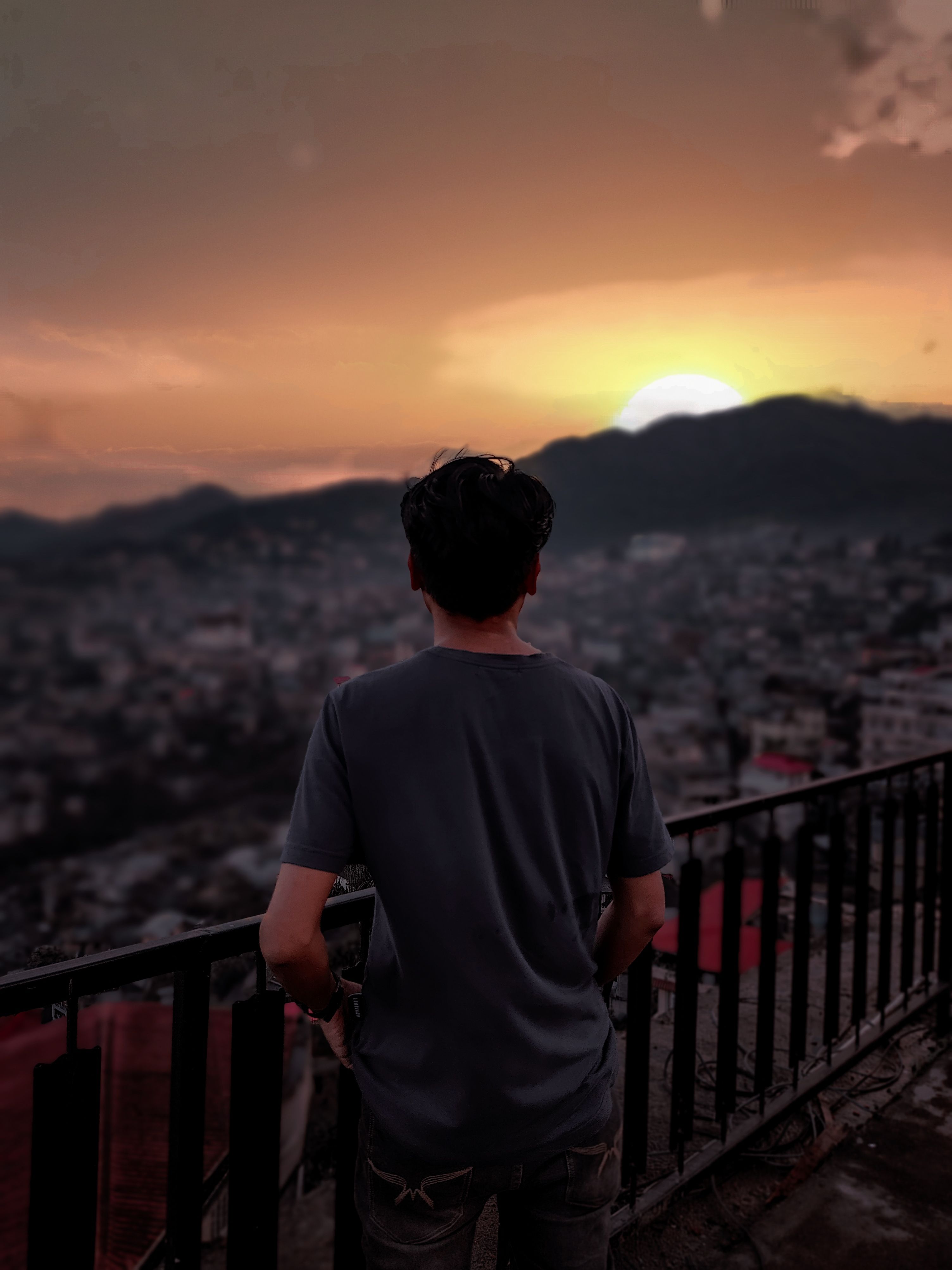 Man Standing and Looking at a City in the Distance · Free Stock Photo