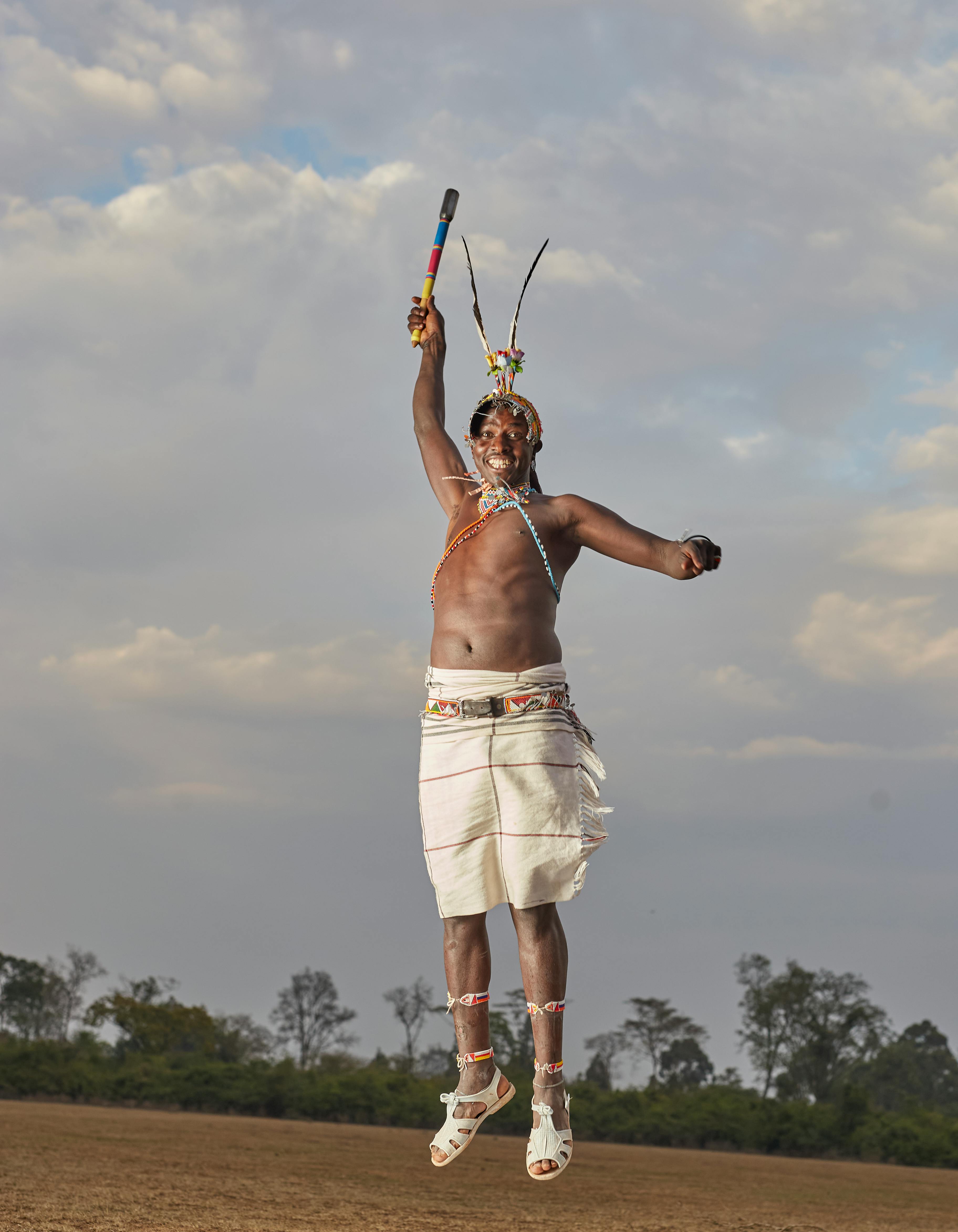 A Man in White Traditional Clothing Jumping · Free Stock Photo